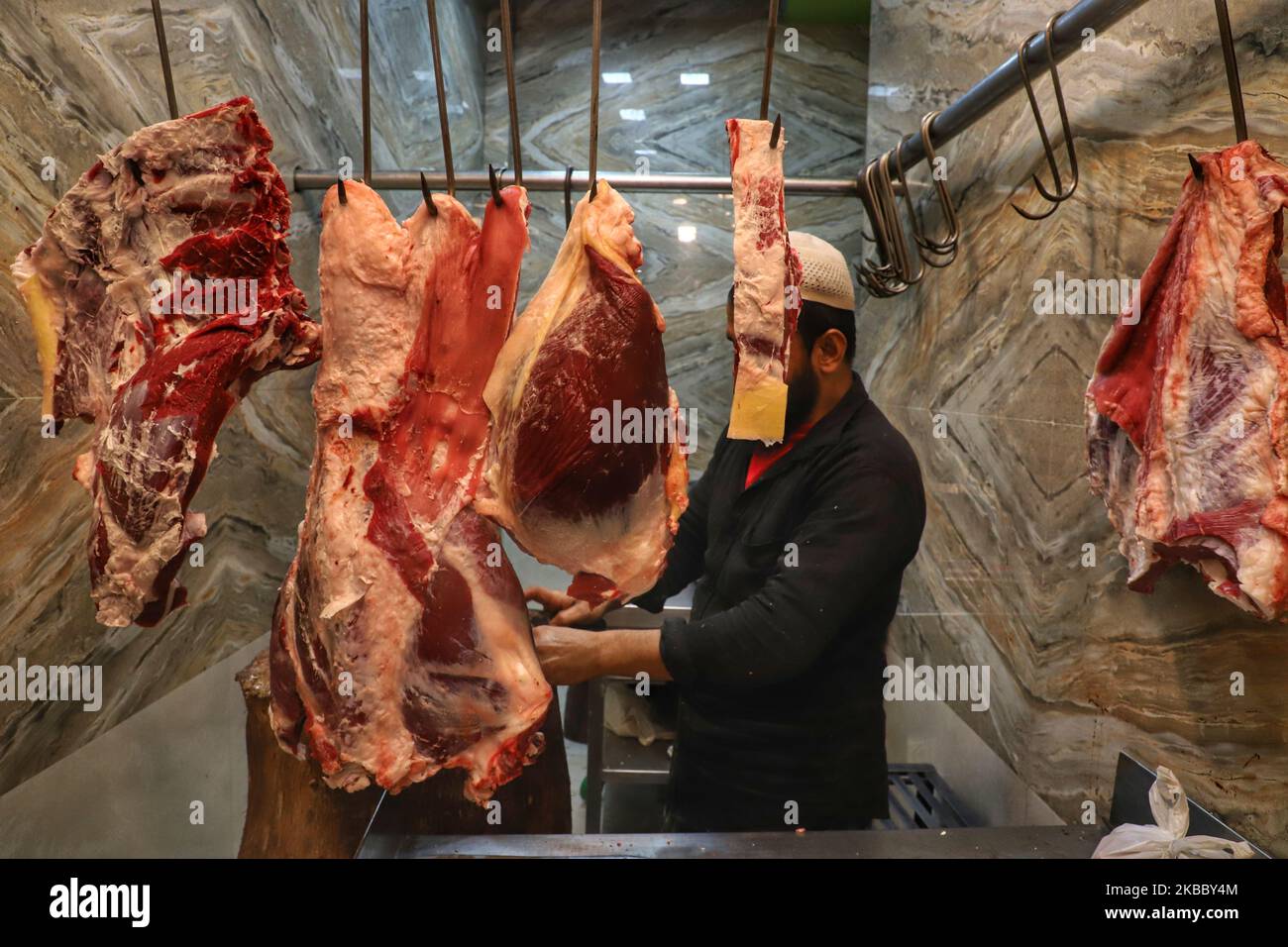 An Indian butcher selling buffalo meat (buff) in New Delhi, India on 30 ...