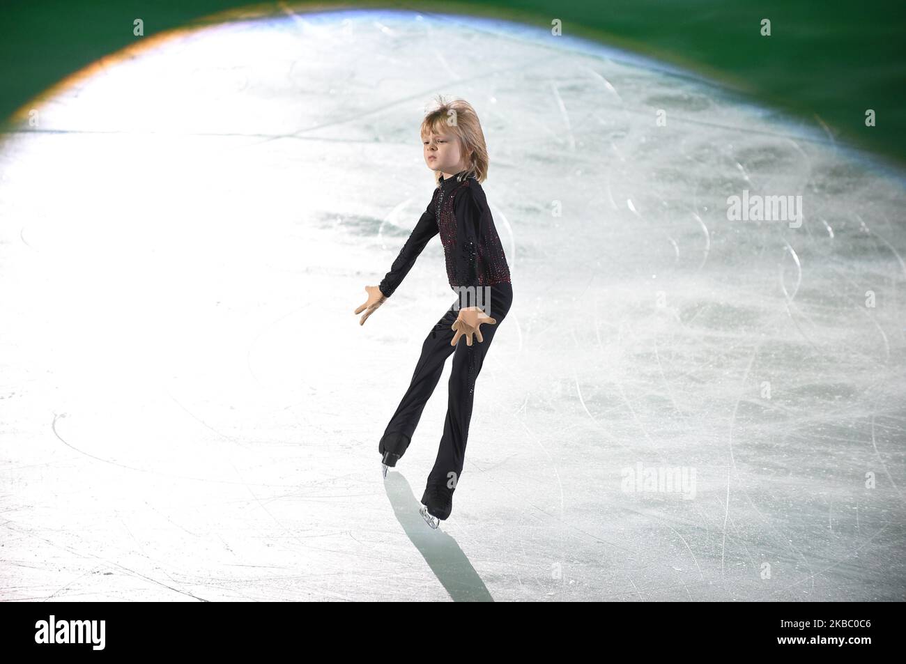 Russian skaters Evgini Plushenko and his son Alexander skating during ...