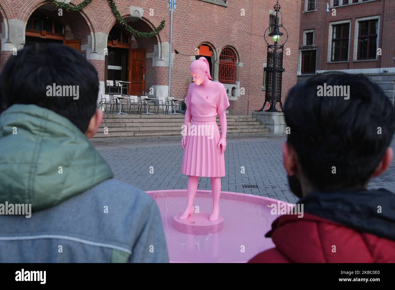 People watch a 3D printed statue of the Dutch AIDS Foundation at the ...