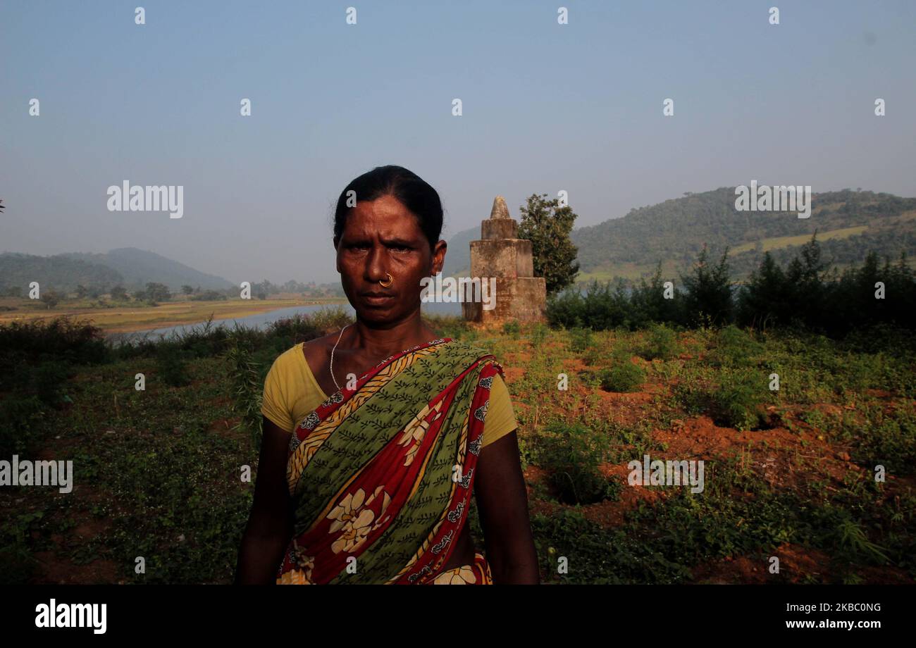 Villagers are seen inside the Balimela reservor as they moves out by ...