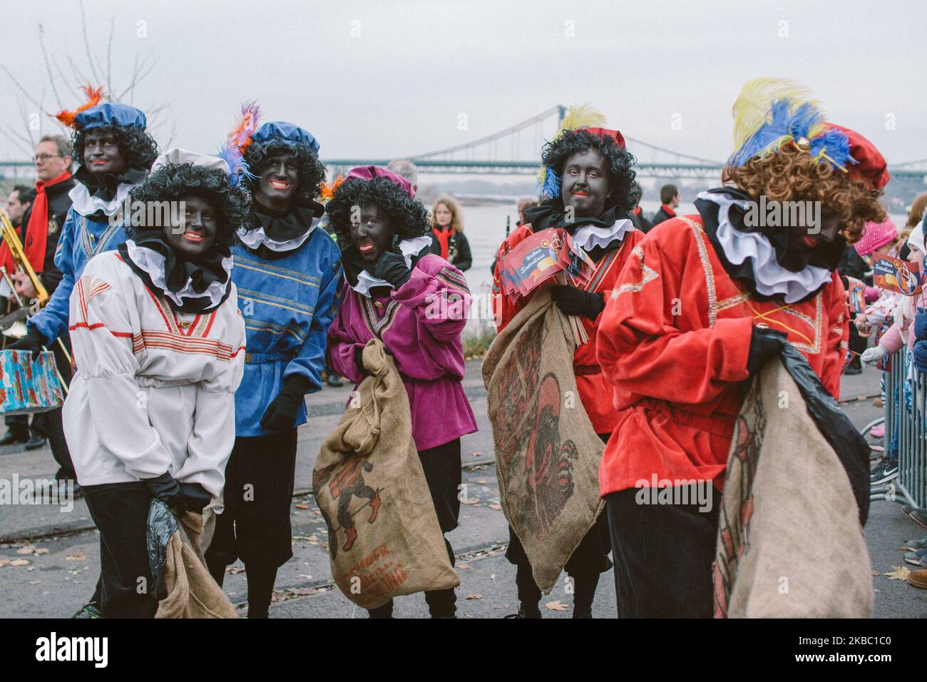 People dressed as Zwarte Piet or Black Pete pose during an event ...