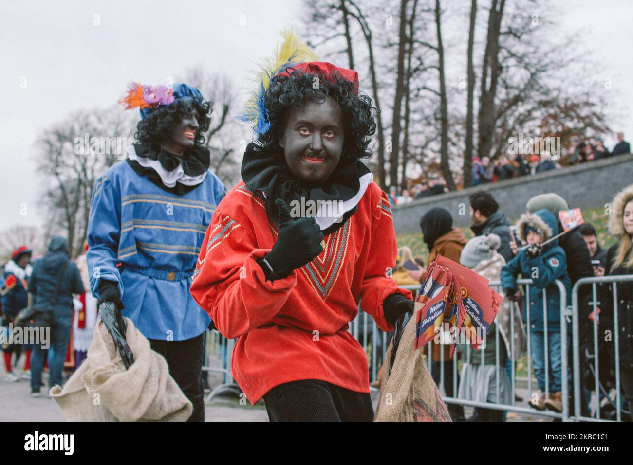 People dressed as traditional characters known as Zwarte Piet or Black ...