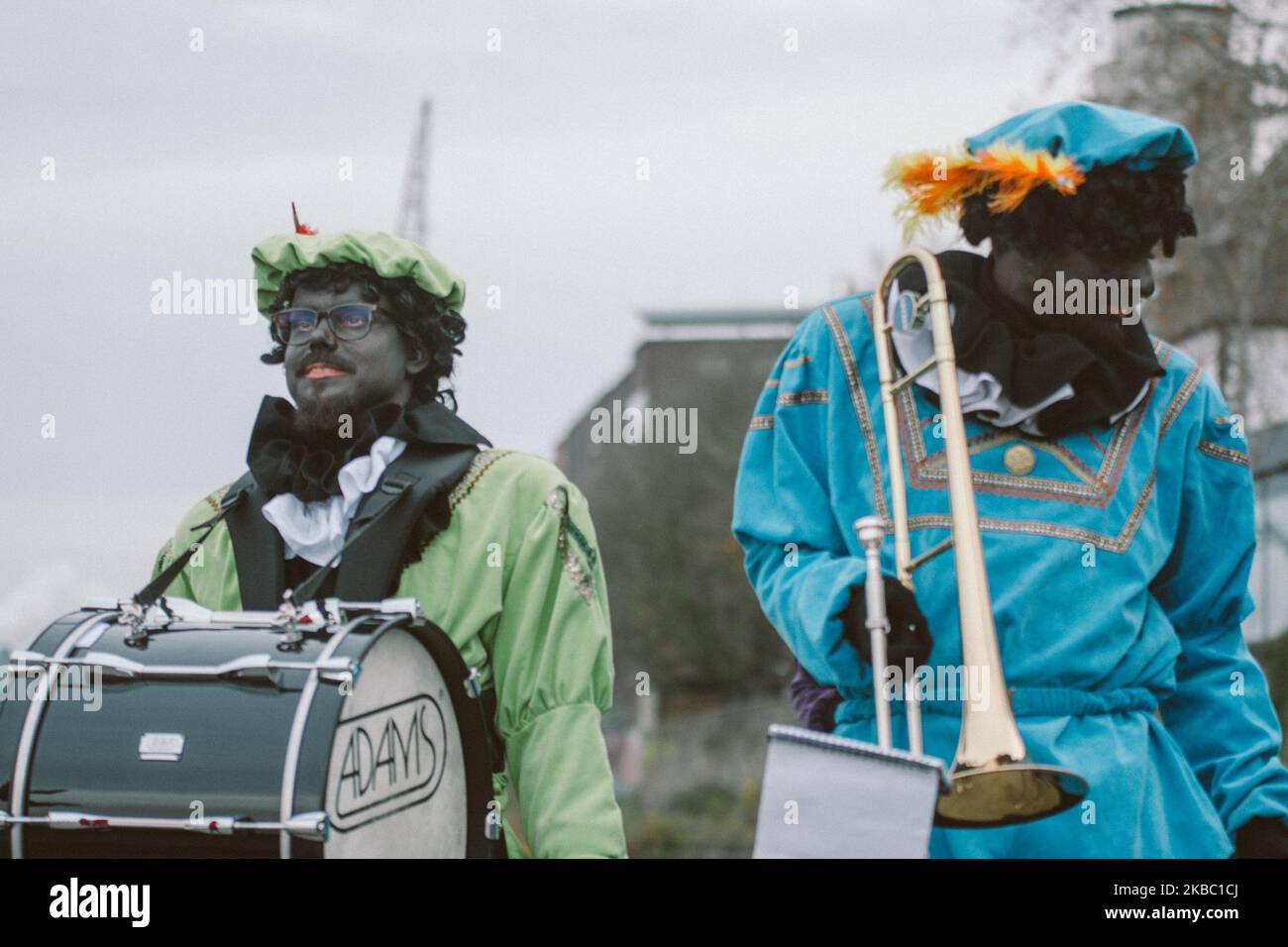 people dresses as Zwarte Piet or Black Pete, play band before Saint ...