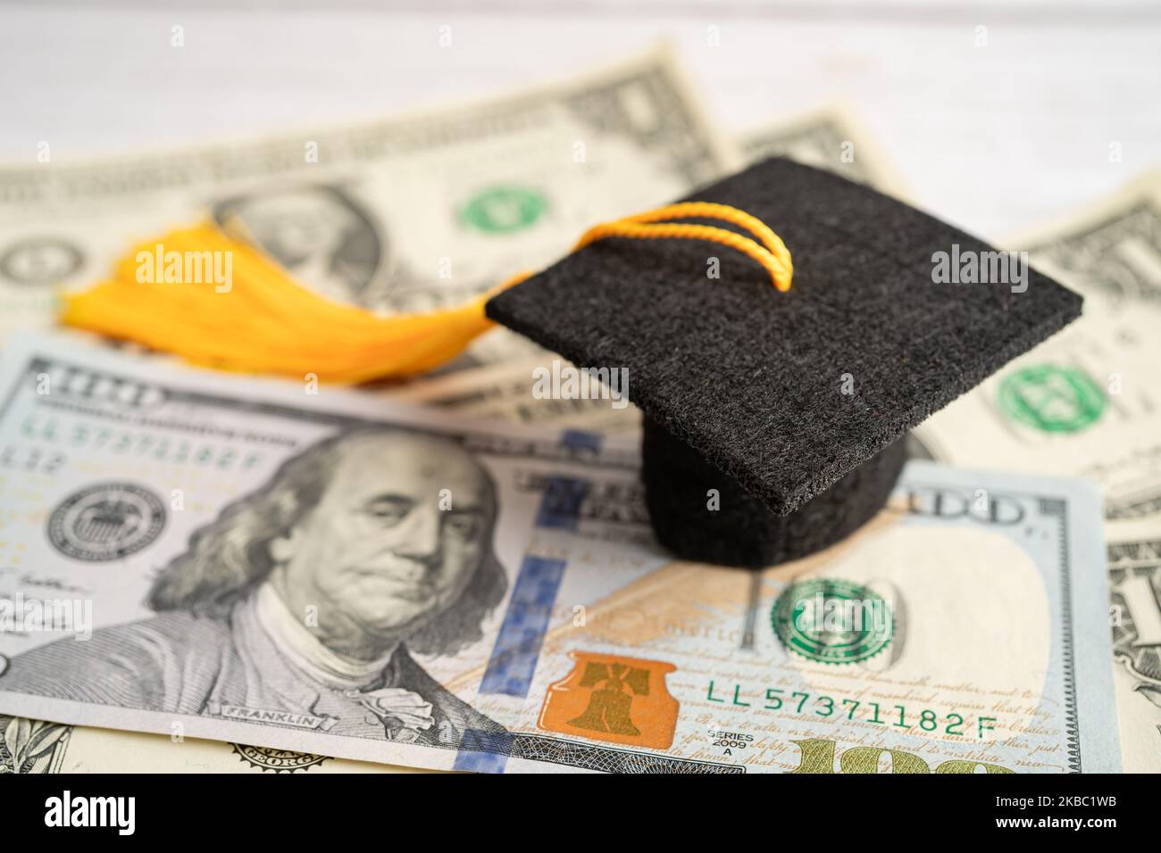 Graduation gap hat on US dollar banknotes money, Education study fee ...