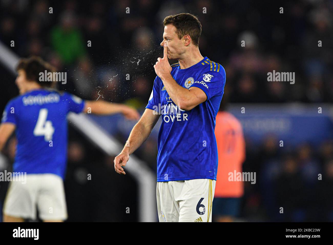 Jonny Evans (6) of Leicester City clears his nose during the Premier ...
