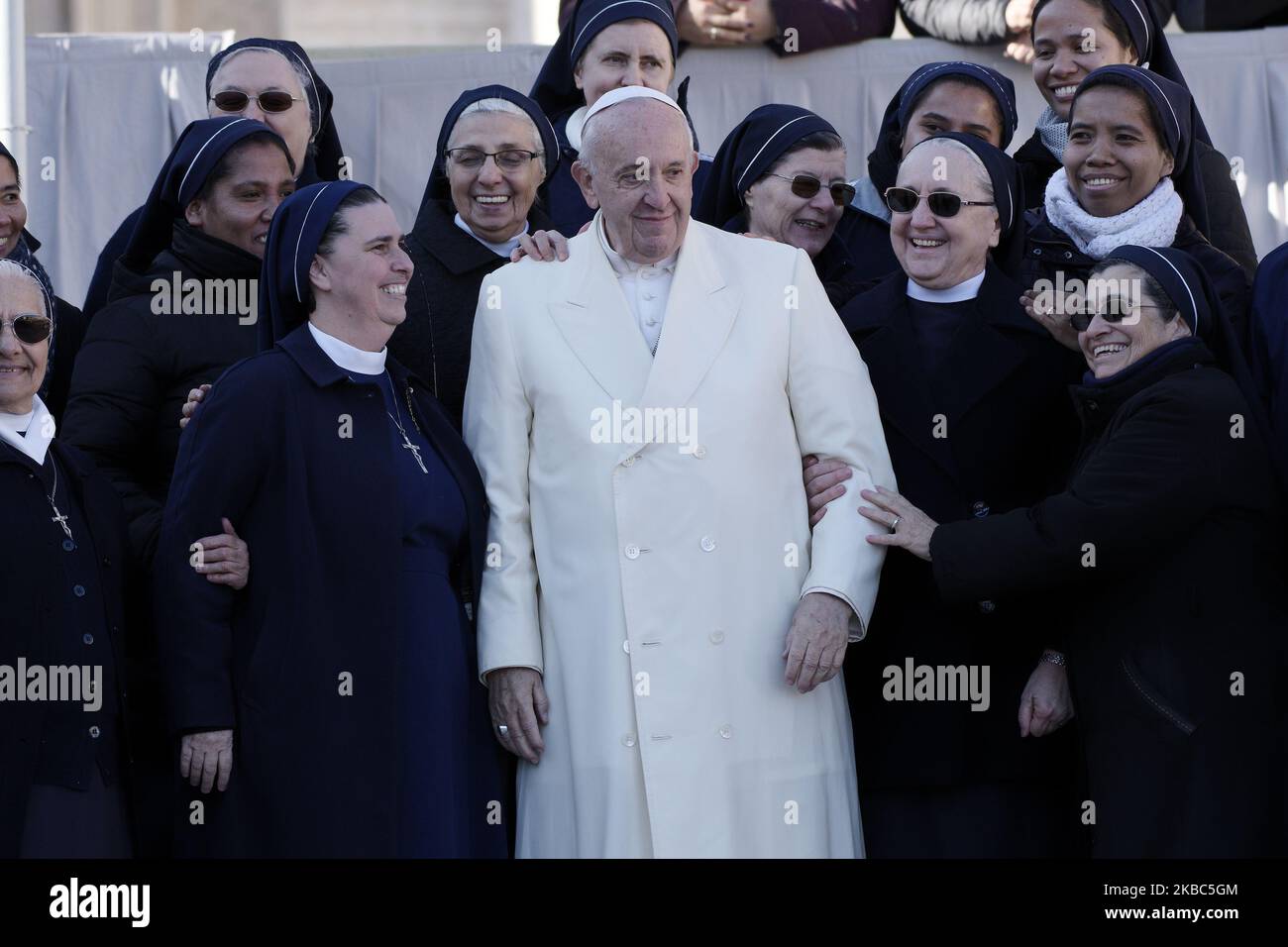 Pope Francis poses with a group of flag nuns at the end of his weekly ...