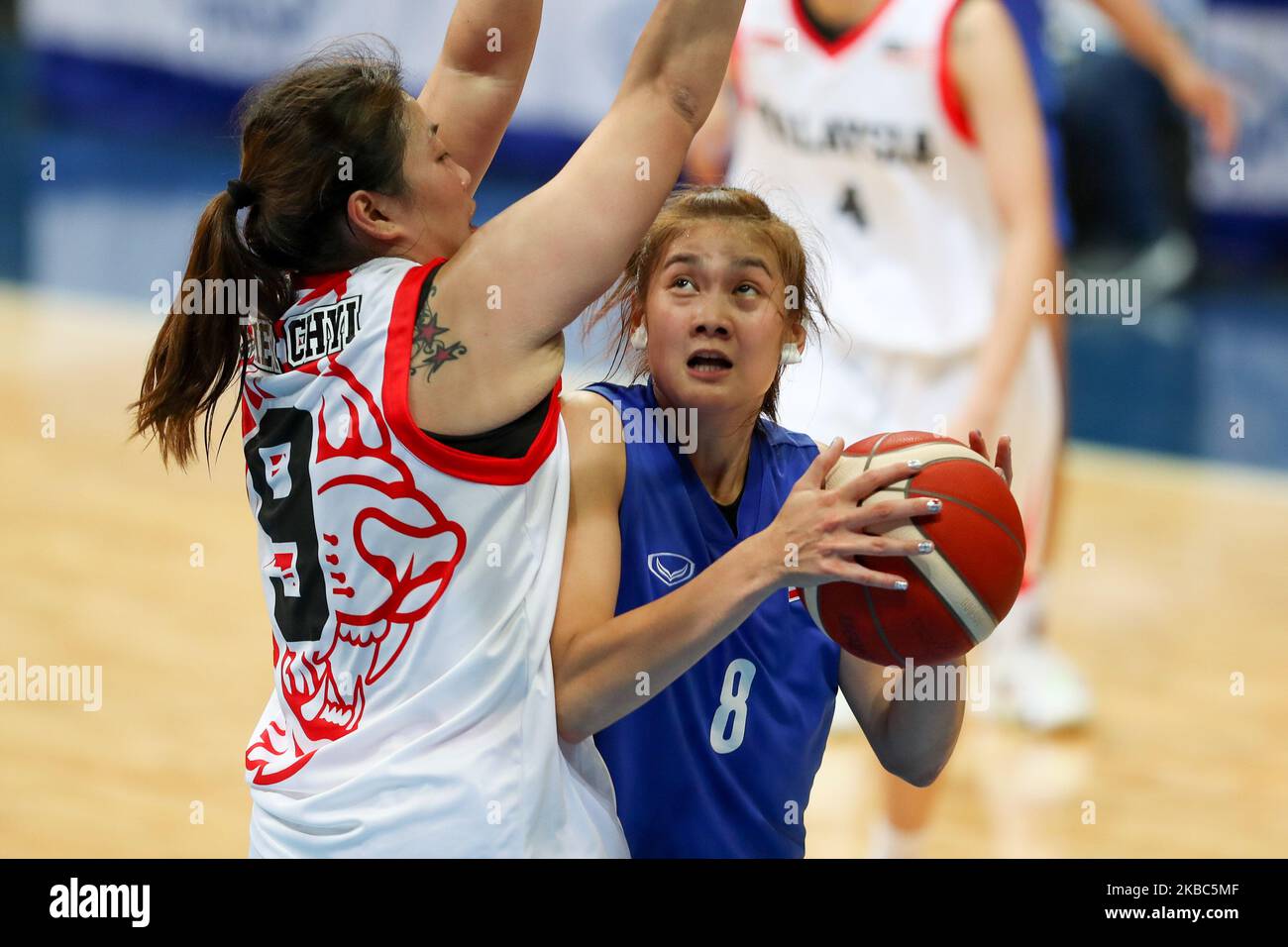 Players in action during the match between Malaysia and Thailand in ...