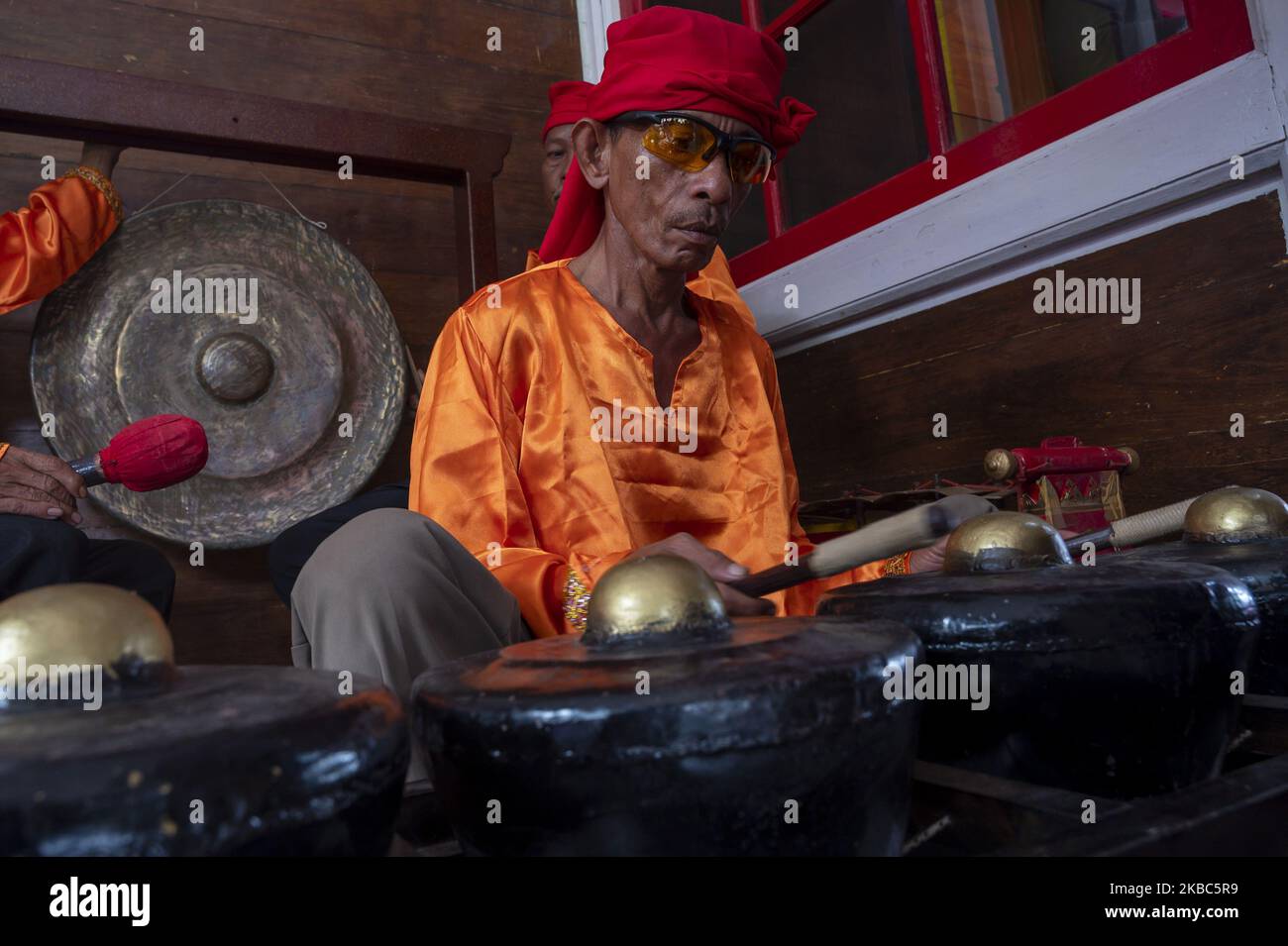 Indigenous people play traditional musical instruments accompanying the ...