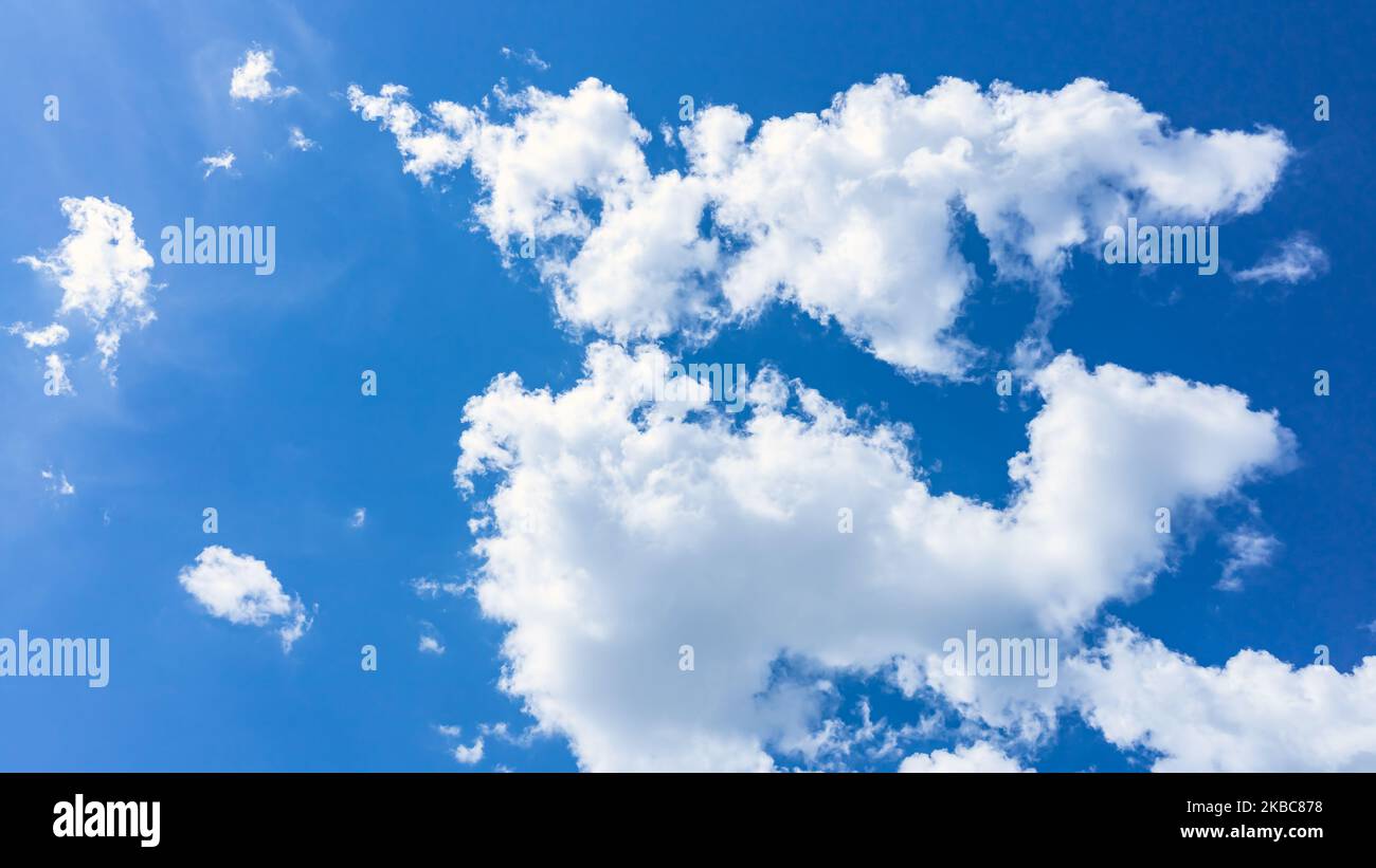 Clouds in the blue sky. Natural sky background texture, beautiful color. Peaceful blue sky with ...