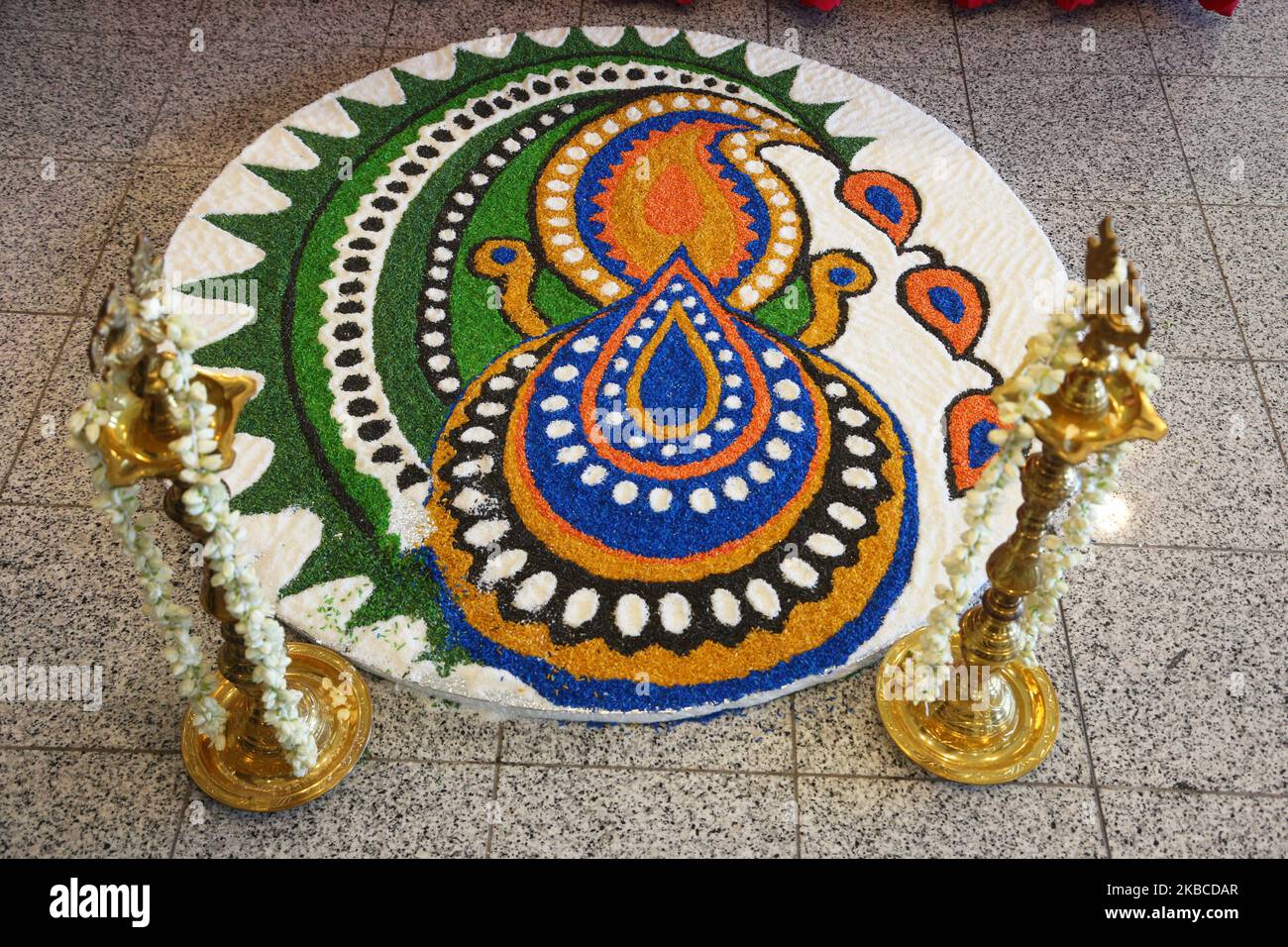Decorative rangoli (traditional floor art) design made with colourful ...