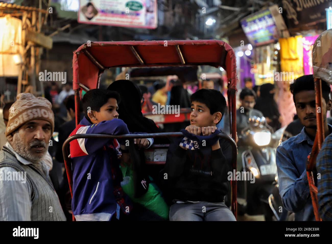Kids travel in a cycle rickshaw in Old Delhi india on 08 December 2019 ...