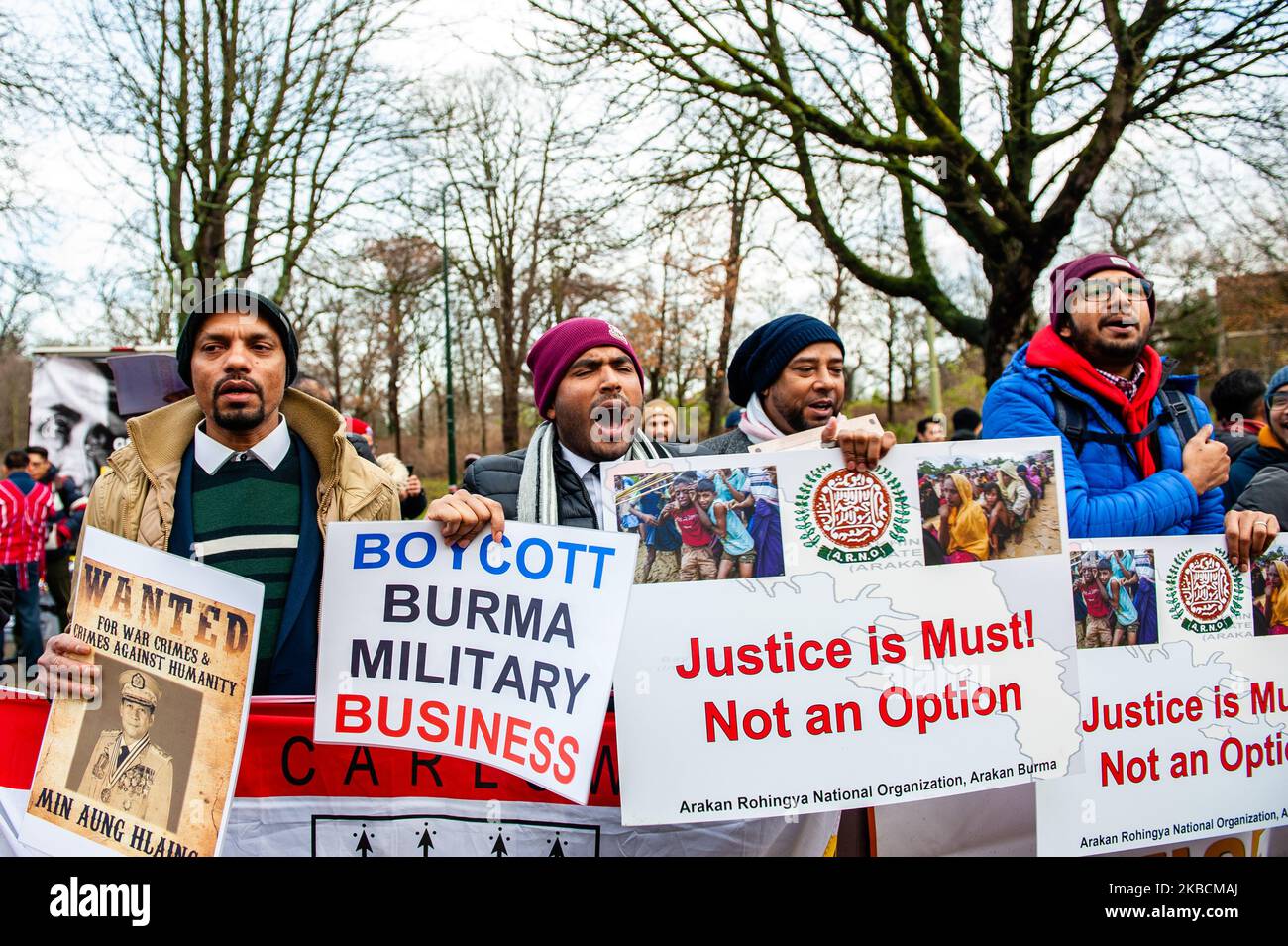 A group of people in support of Rohingya are shouting slogans and ...