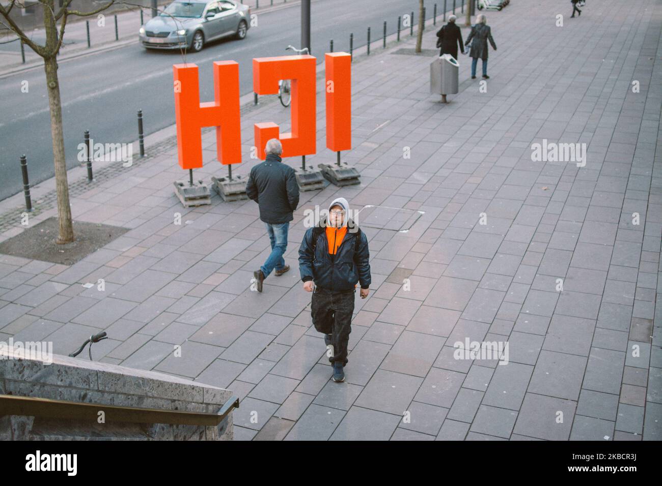 people walks pass by the 'ICH' art installation at the centre of inner ...