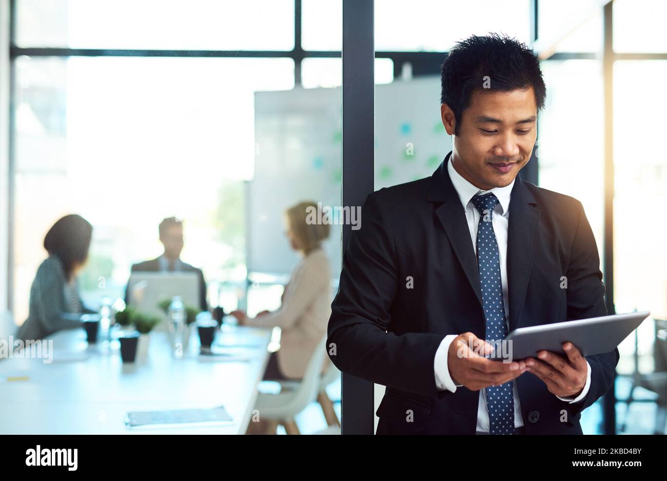 Getting things done by using technology. a handsome young businessman ...