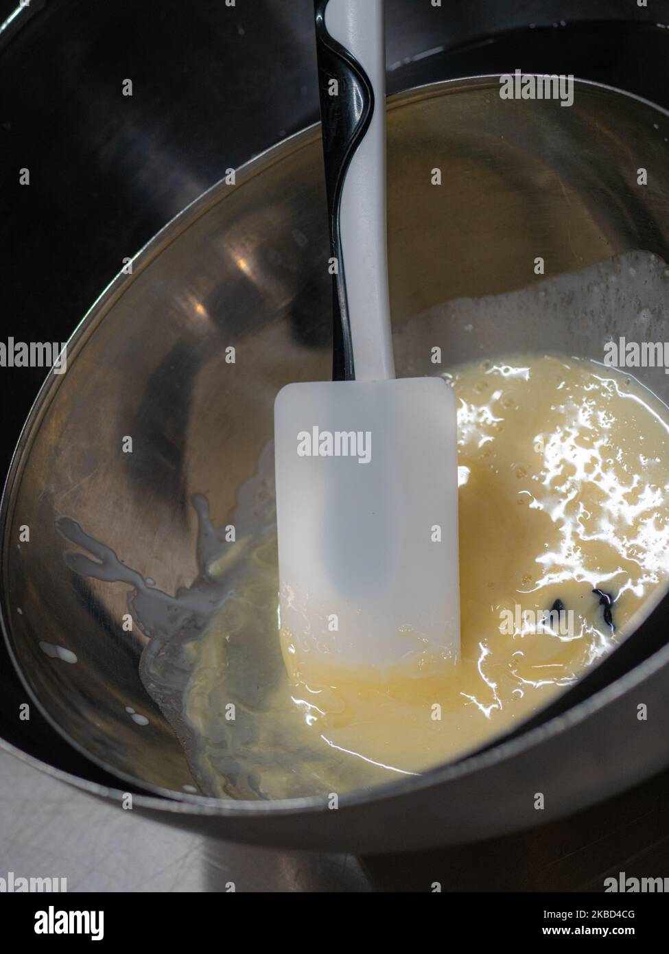 pastry chef cake designer preparing blue white cheesecake in kitchen ...