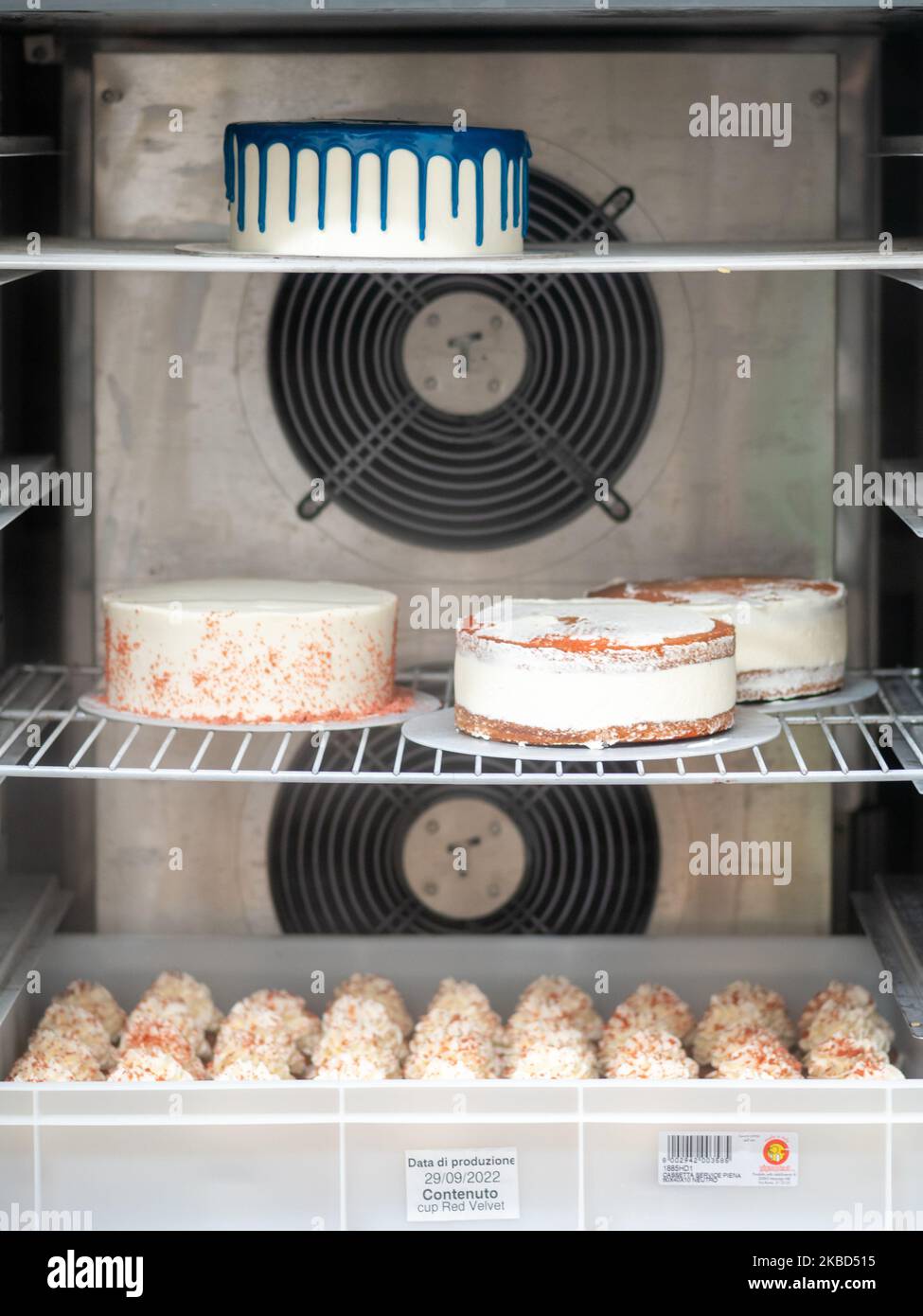 pastry chef cake designer preparing blue white cheesecake in kitchen ...