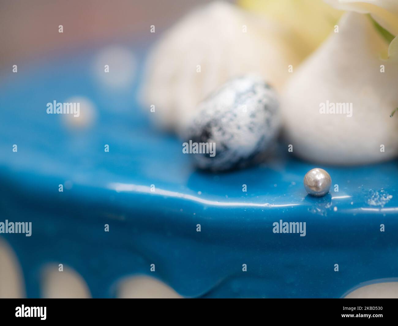 pastry chef cake designer preparing blue white cheesecake in kitchen ...