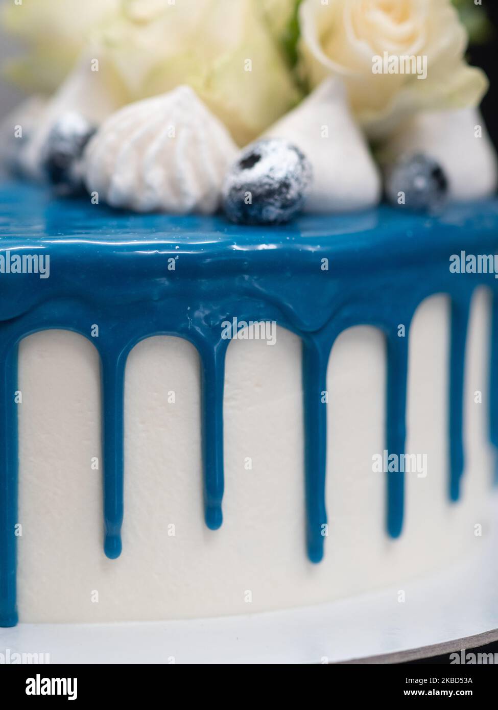pastry chef cake designer preparing blue white cheesecake in kitchen ...