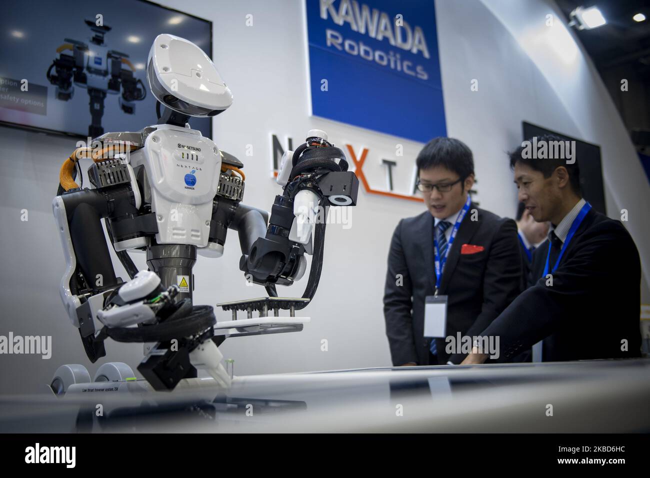 Humanoid robot stands on display at the International Robot Exhibition ...