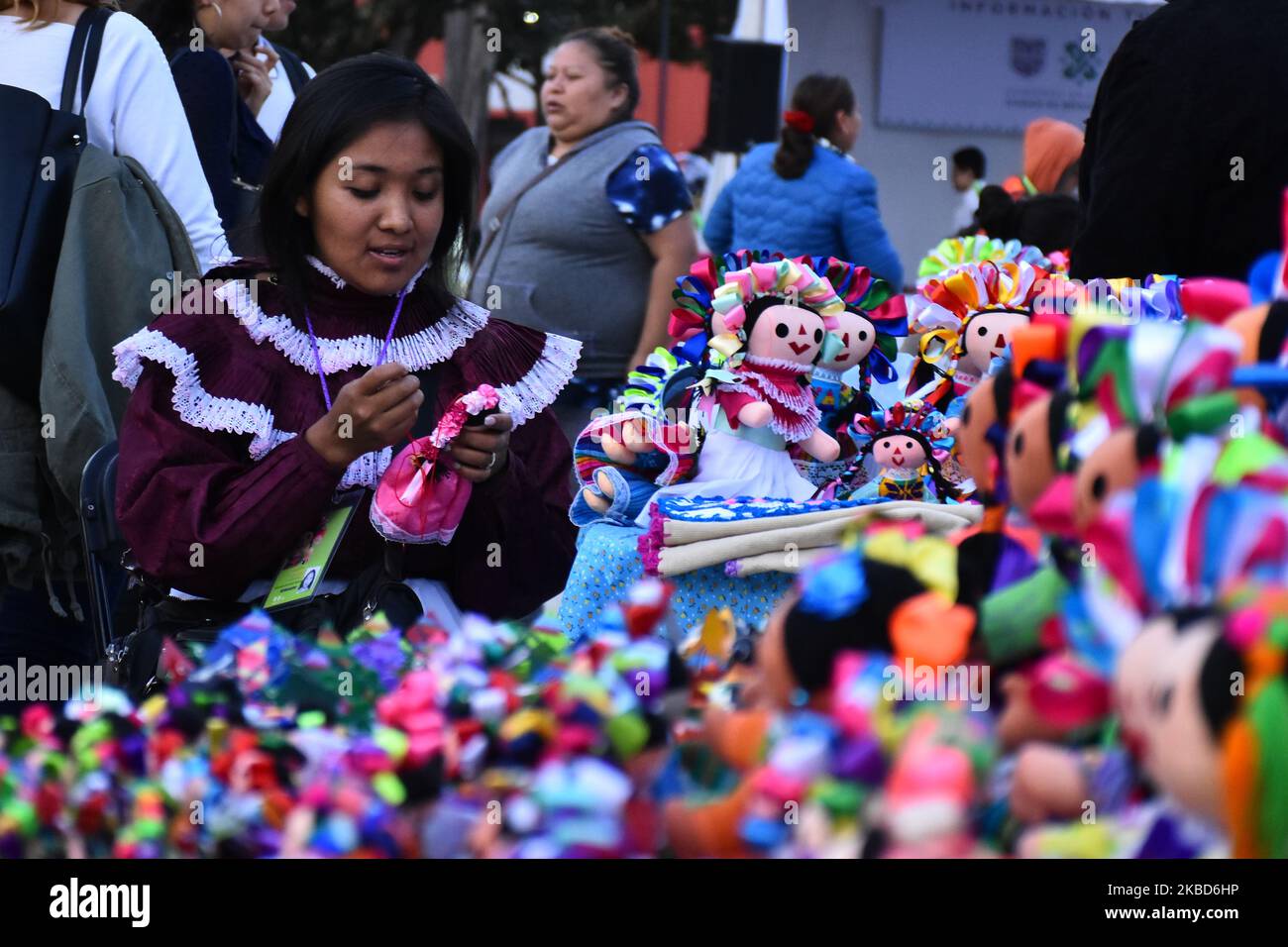 A woman indigenous seen manufacturing a typical doll during the Otomi ...
