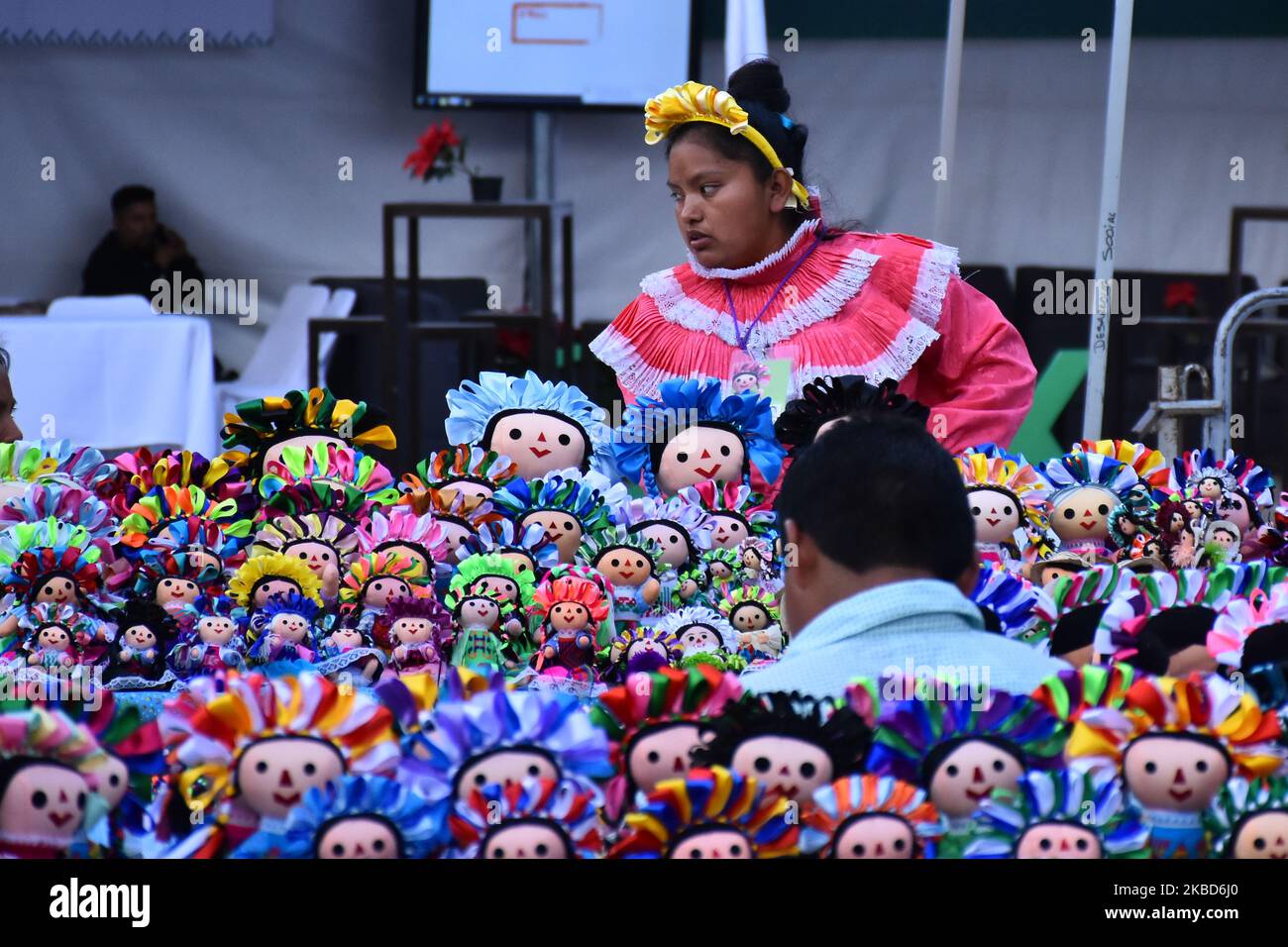 A woman indigenous seen manufacturing a typical doll during the Otomi ...
