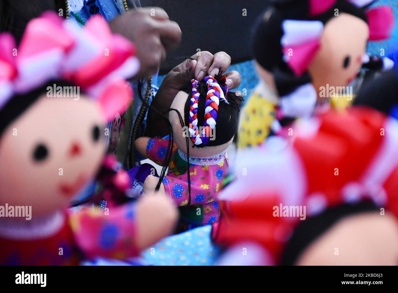 A woman indigenous seen manufacturing a typical doll during the Otomi ...