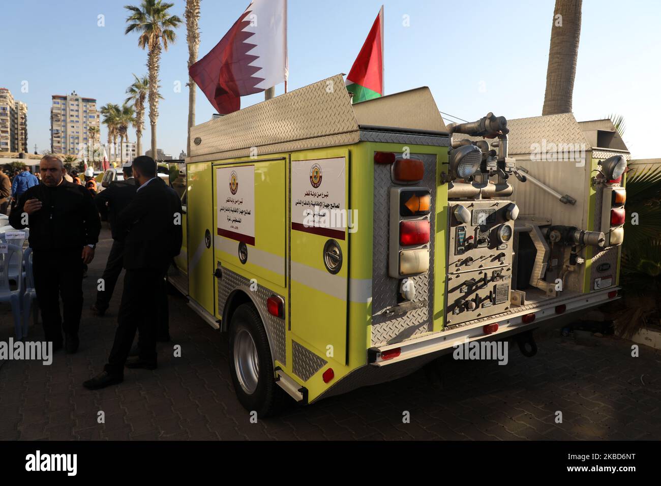 Palestinian Civil Defense Forces stand next to 24 vehicles, donated by ...