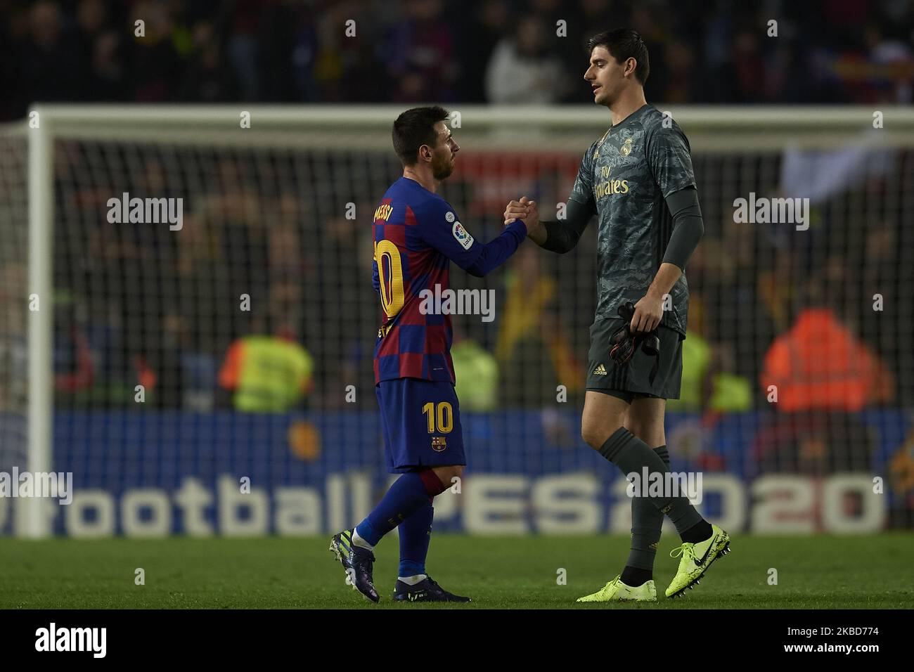 Lionel Messi of Barcelona and Thibaut Courtois of Real Madrid greet ...
