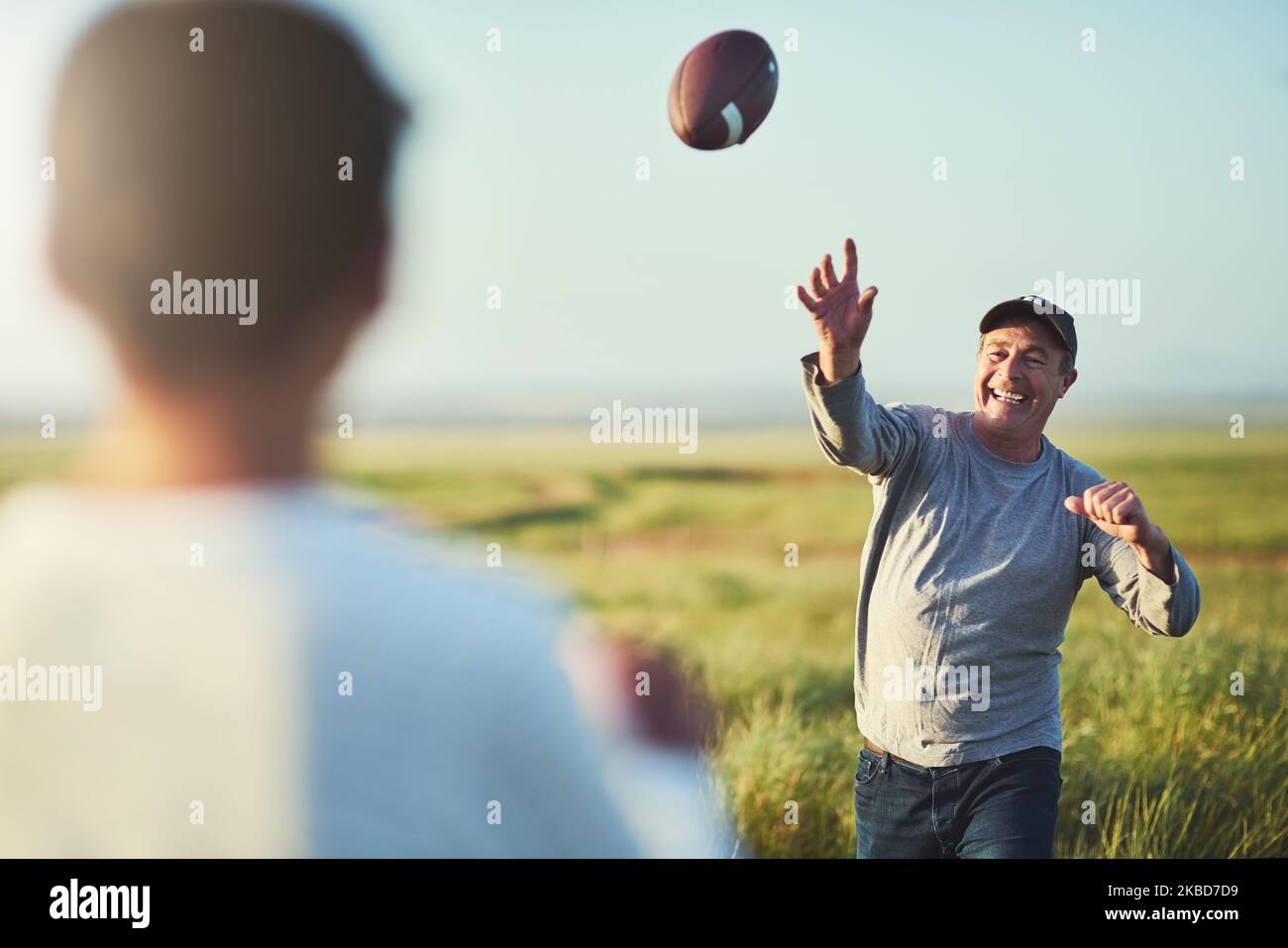 We have so much fun even when just tossing a ball. father throwing a ...