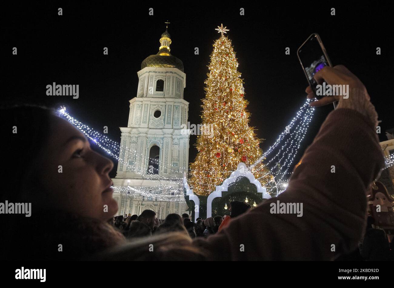 An Ukrainian girl takes photo during the lighting ceremony of the main ...