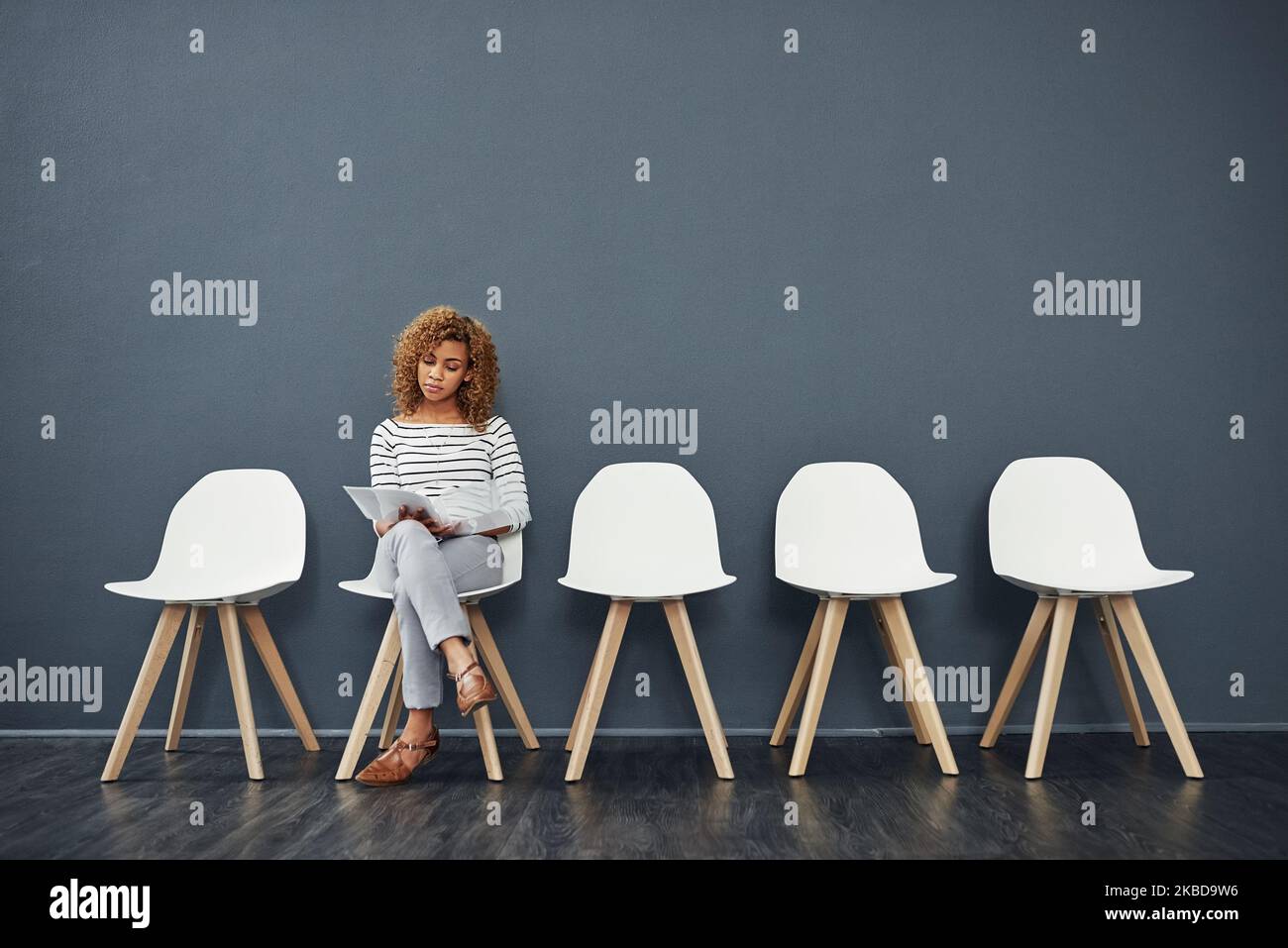 Staying well-prepared for her interview. Full length shot of an ...