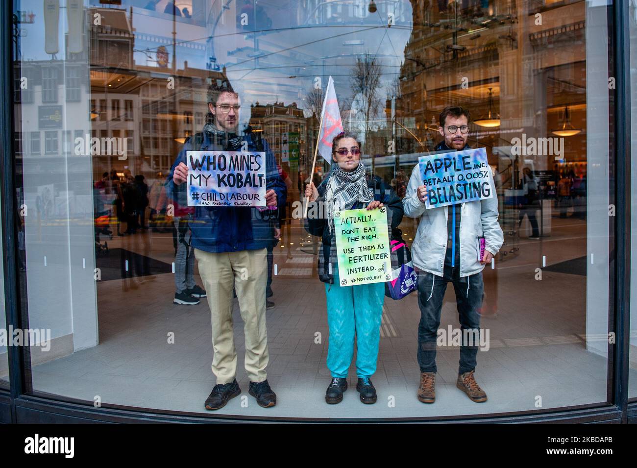 Some XR activists are standing up with placards inside of one of the ...