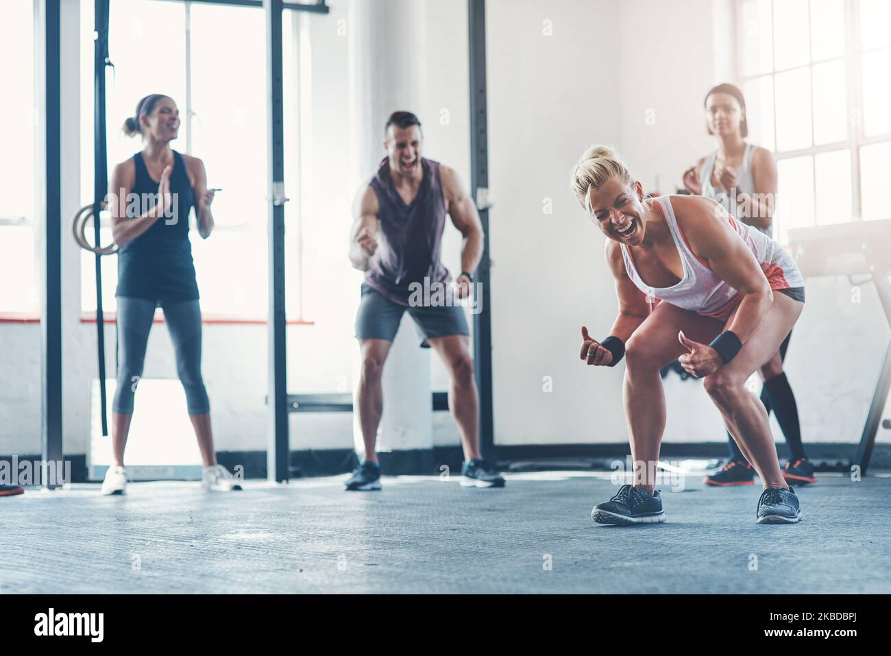 Celebrate every victory. a fitness group celebrating a victory at the ...