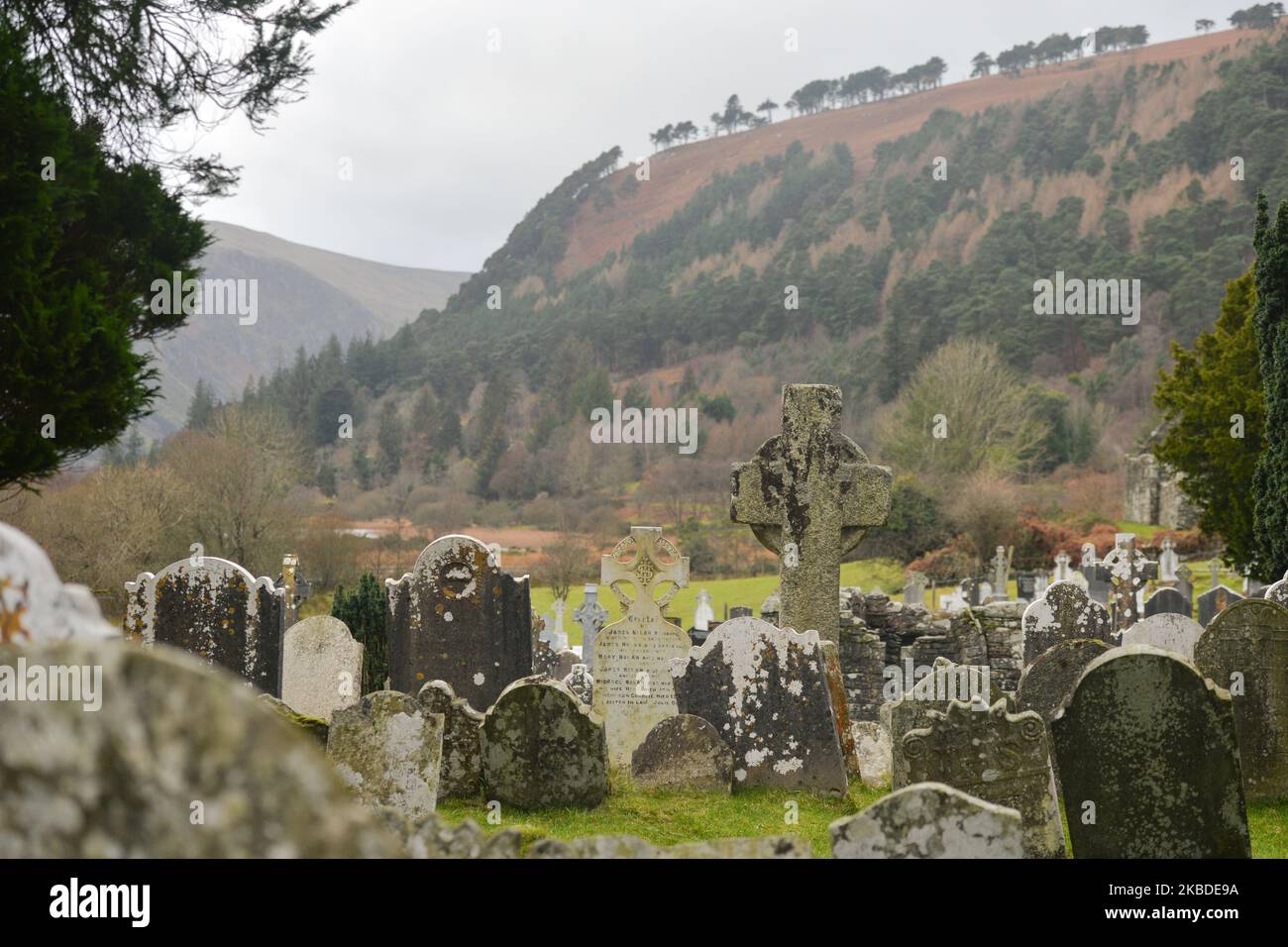 A view of tombstones and Celtic crosses inside an Early Medieval ...