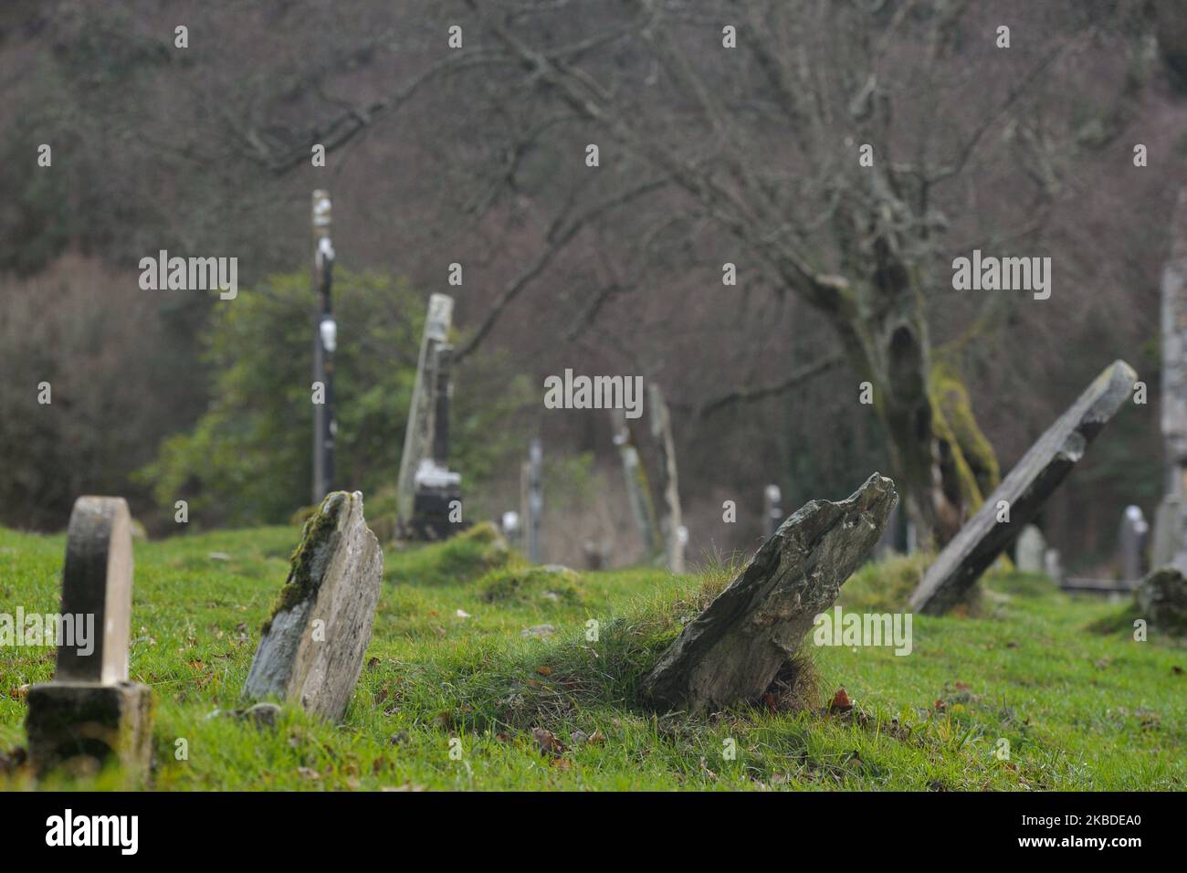 A view of Irish tombstones and Celtic crosses inside an Early Medieval ...