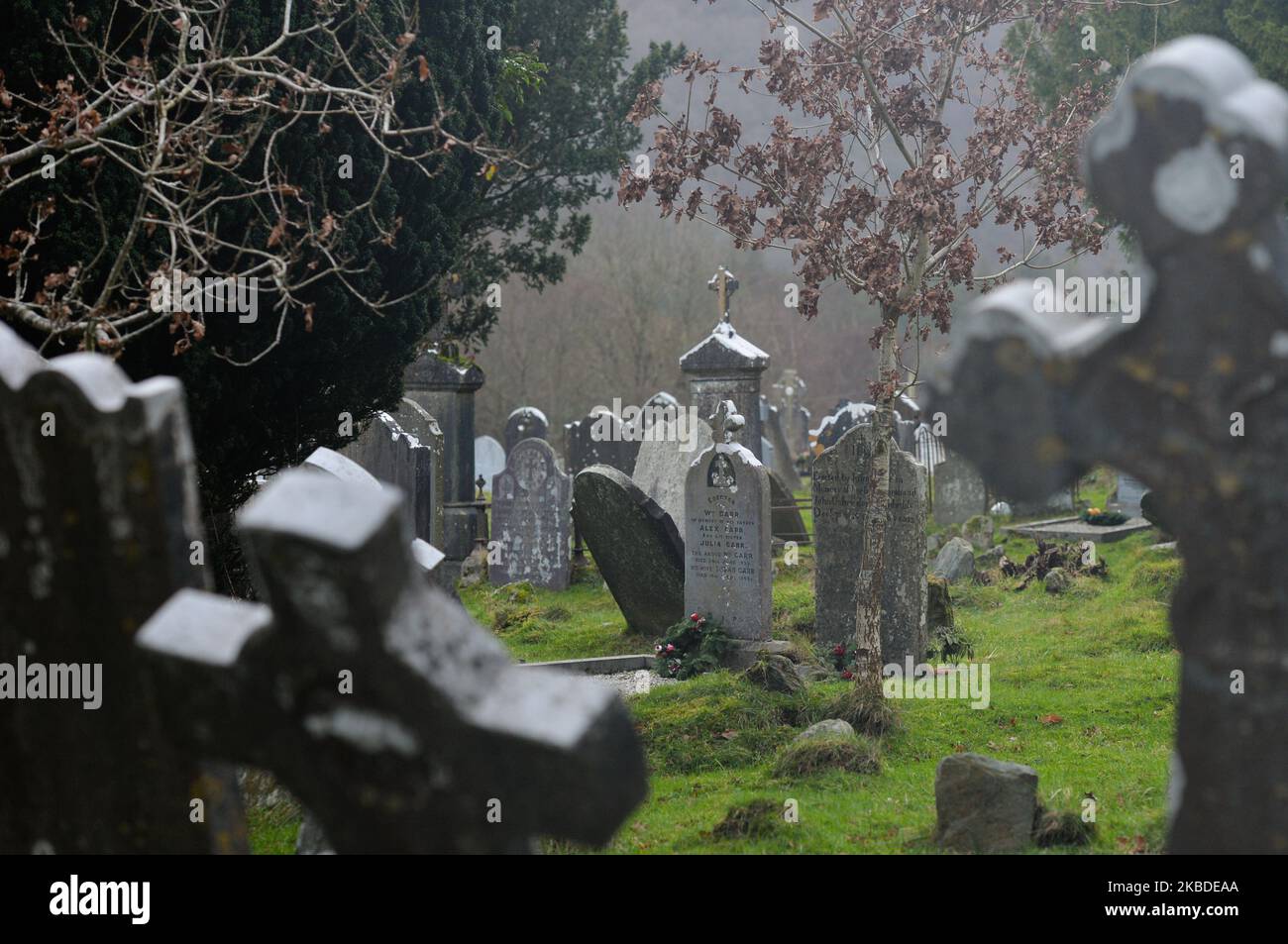A general view of Irish tombstones and Celtic crosses inside an Early ...