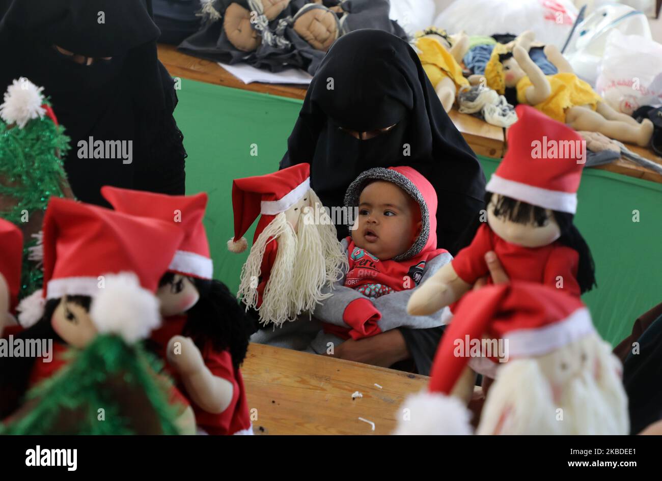 Palestinian artisans sew Christmas toys at Zeina Association and ...