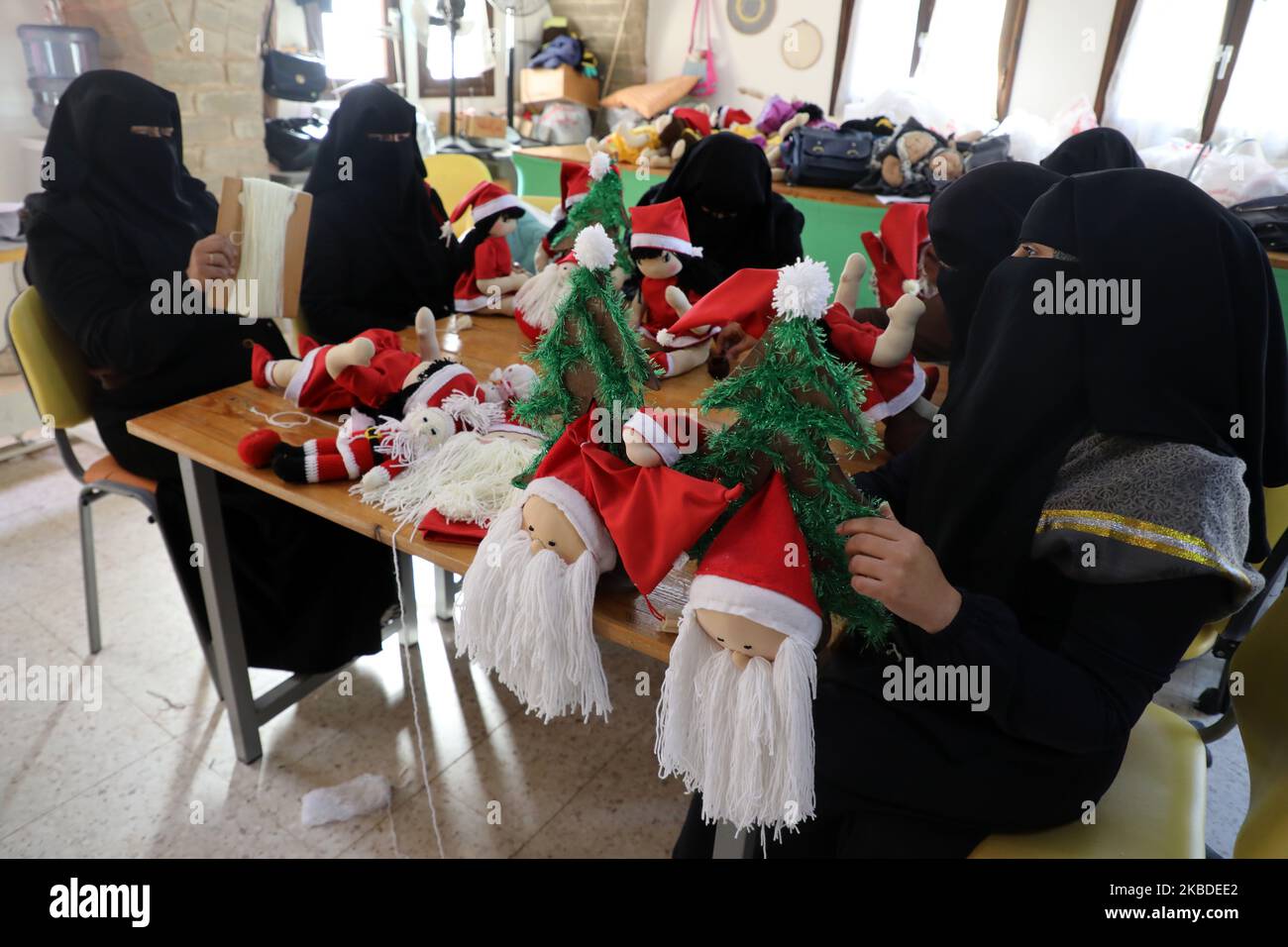 Palestinian artisans make Christmas toys at Zeina Association and ...