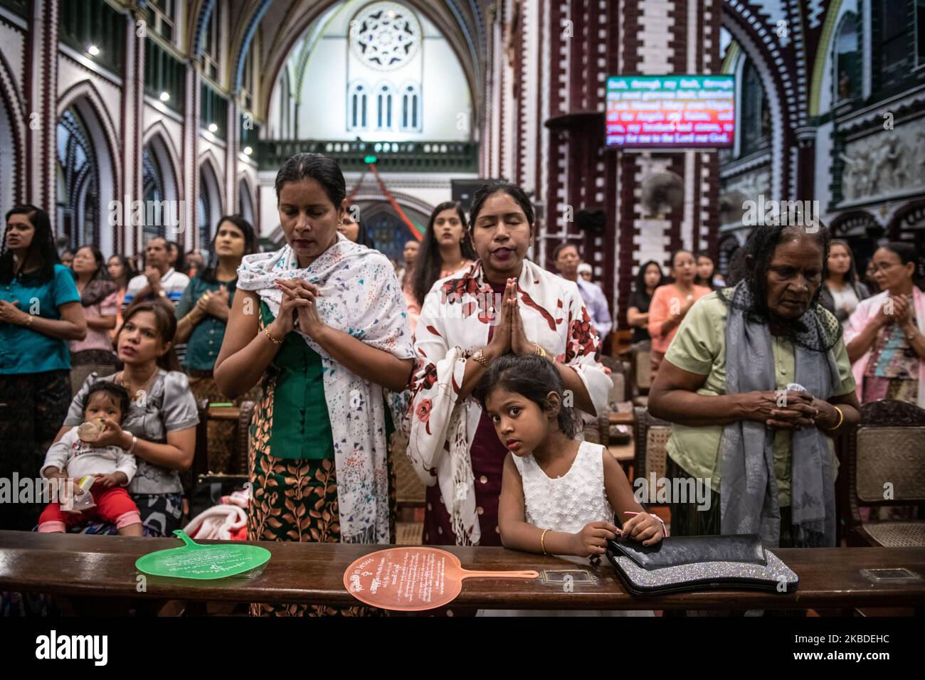 Myanmar Christian devotees pray during a Christmas Eve mass at St. Mary ...