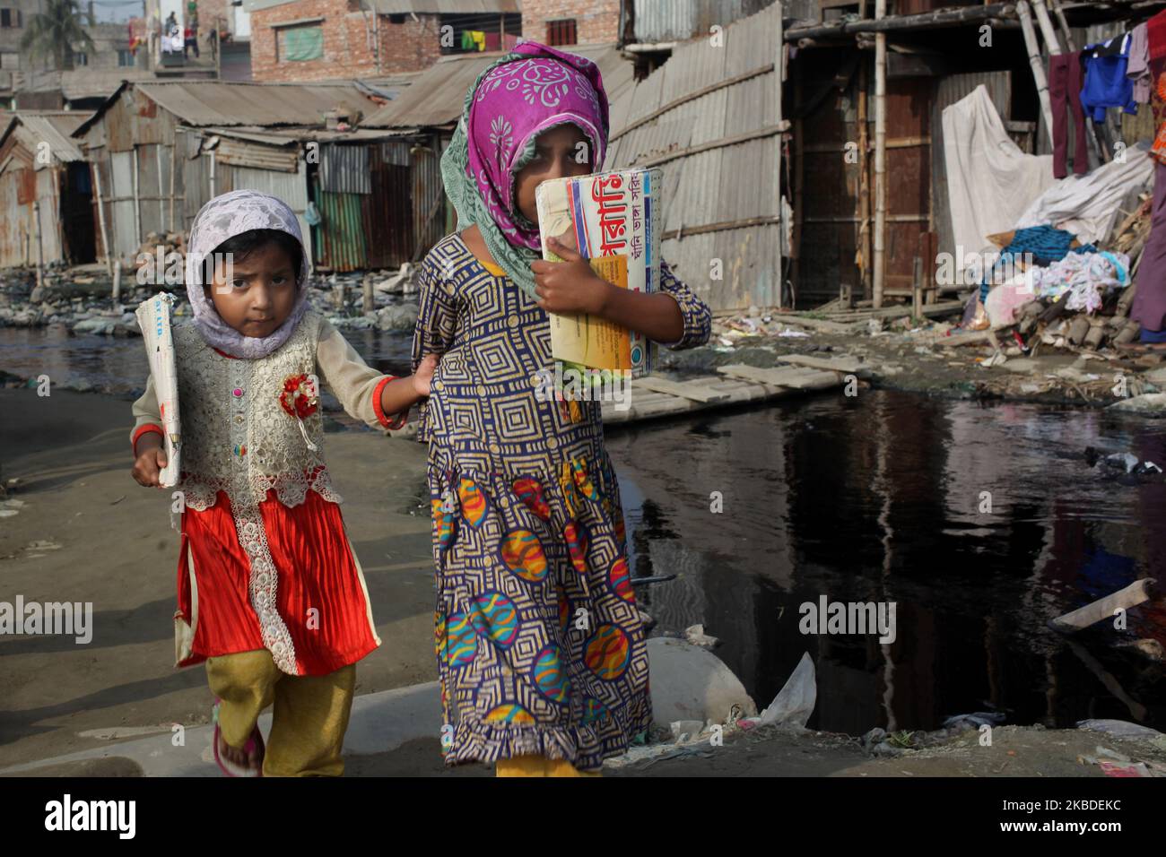 Children reacts to the camera as they are going to Madrasa from a ...