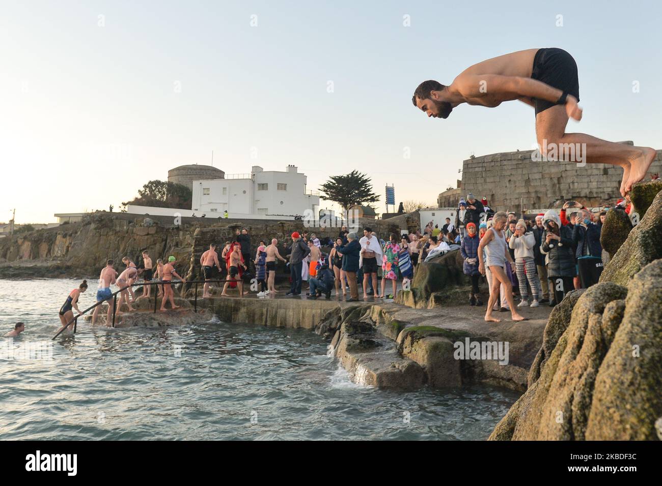 A scene from the annual Christmas Day swim, with hundreds of swimmers ...