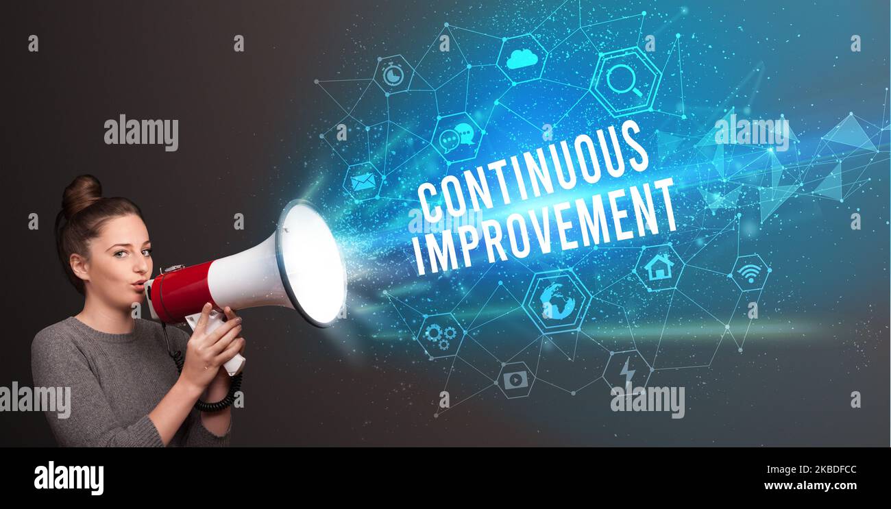 Young woman shouting in megaphone, technology announcement concept ...