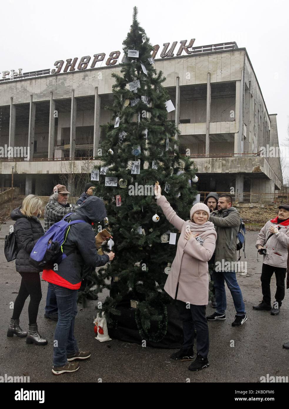 Former Pripyat's residents decorate a Christmas tree installed on a ...