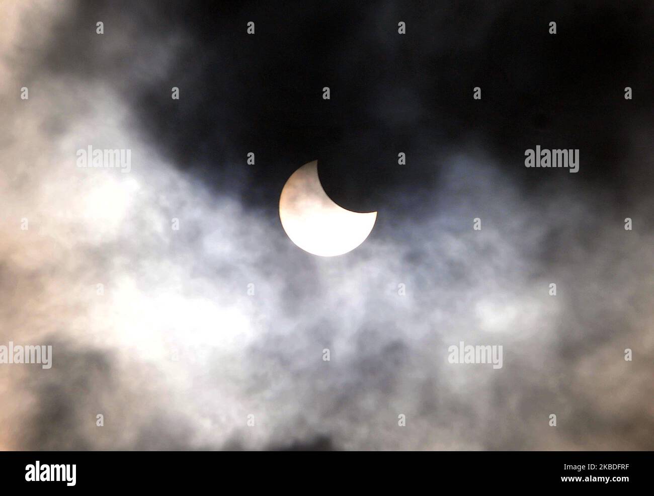 Visitors observe the phenomenon of a partial solar eclipse (GMP ...