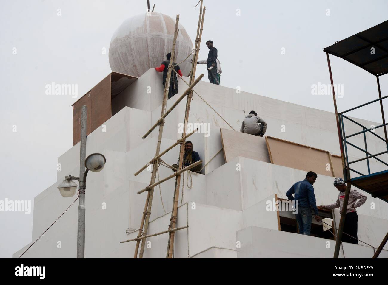 Bangladeshi day labor works at the construction site of Dhaka ...