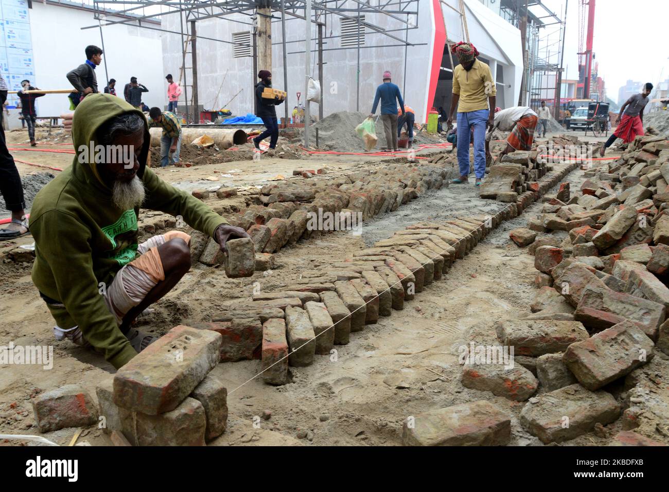 Bangladeshi day labor works at the construction site of Dhaka ...