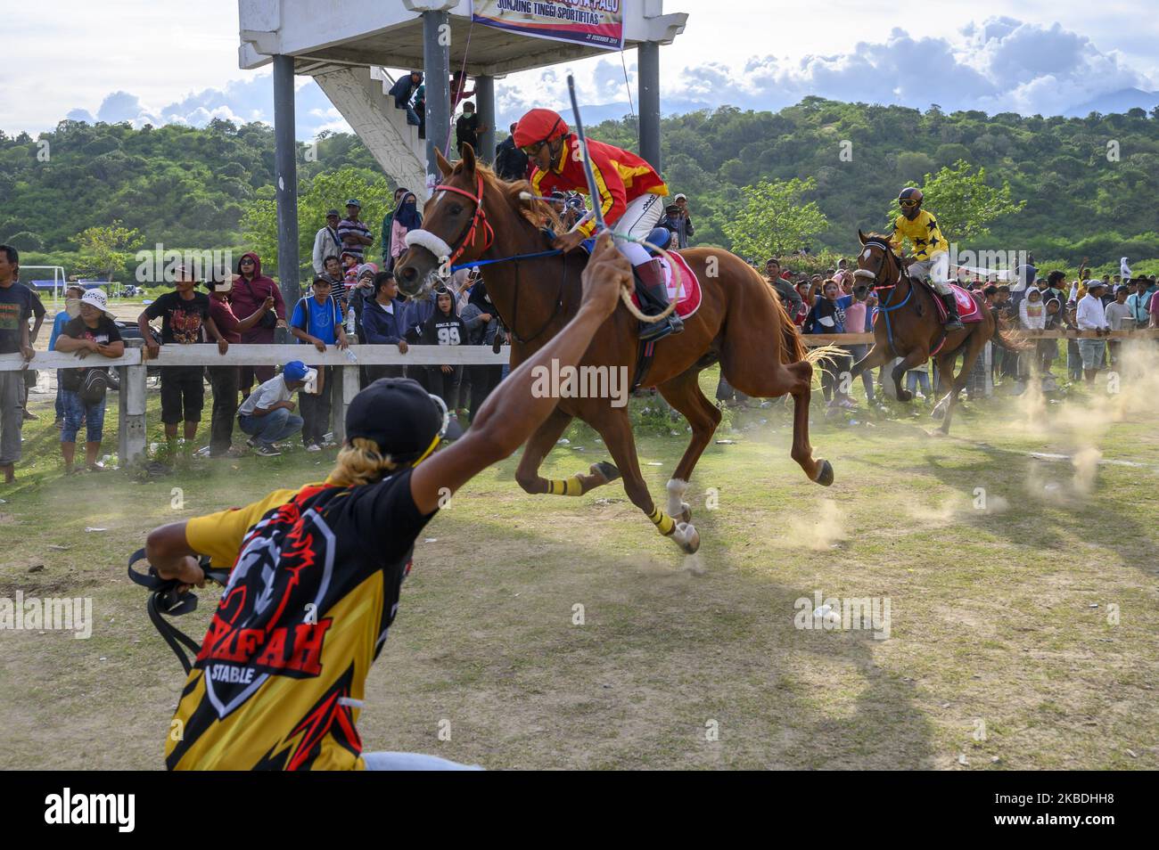 A spectator ran into the racetrack after his superior horse touched the ...