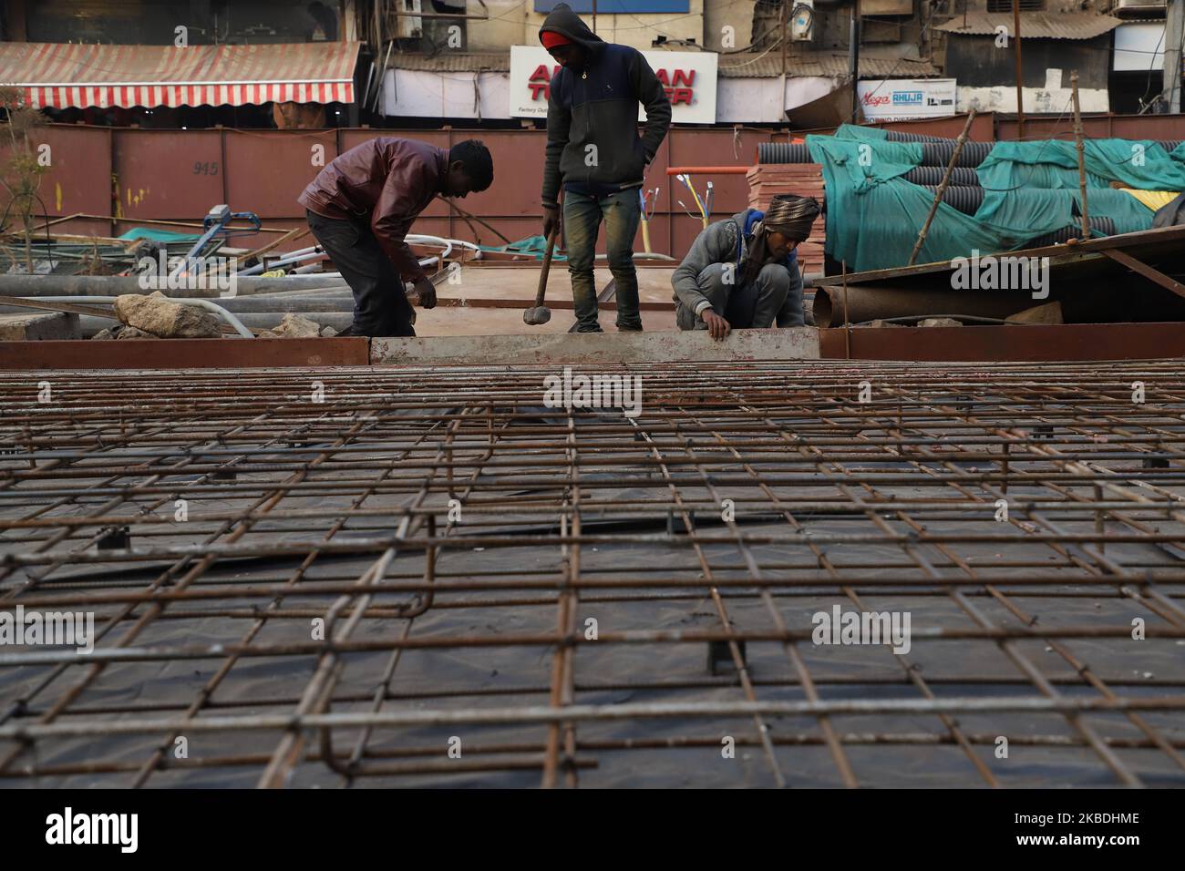 Labours work at a construction site in Old Delhi India on 28 December ...