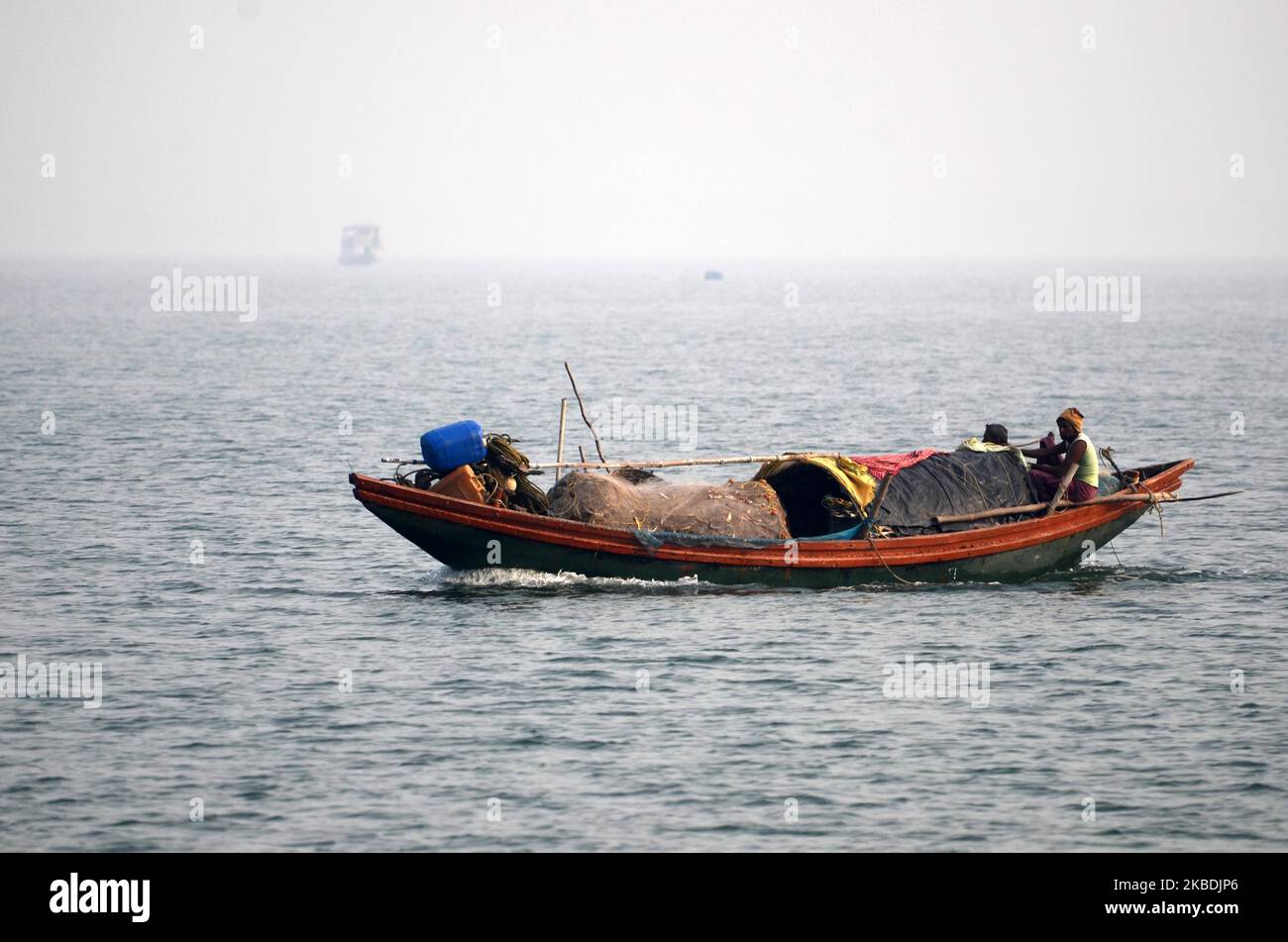 Indian Fishermen catch fishes in foggy morning on the Matla river in ...