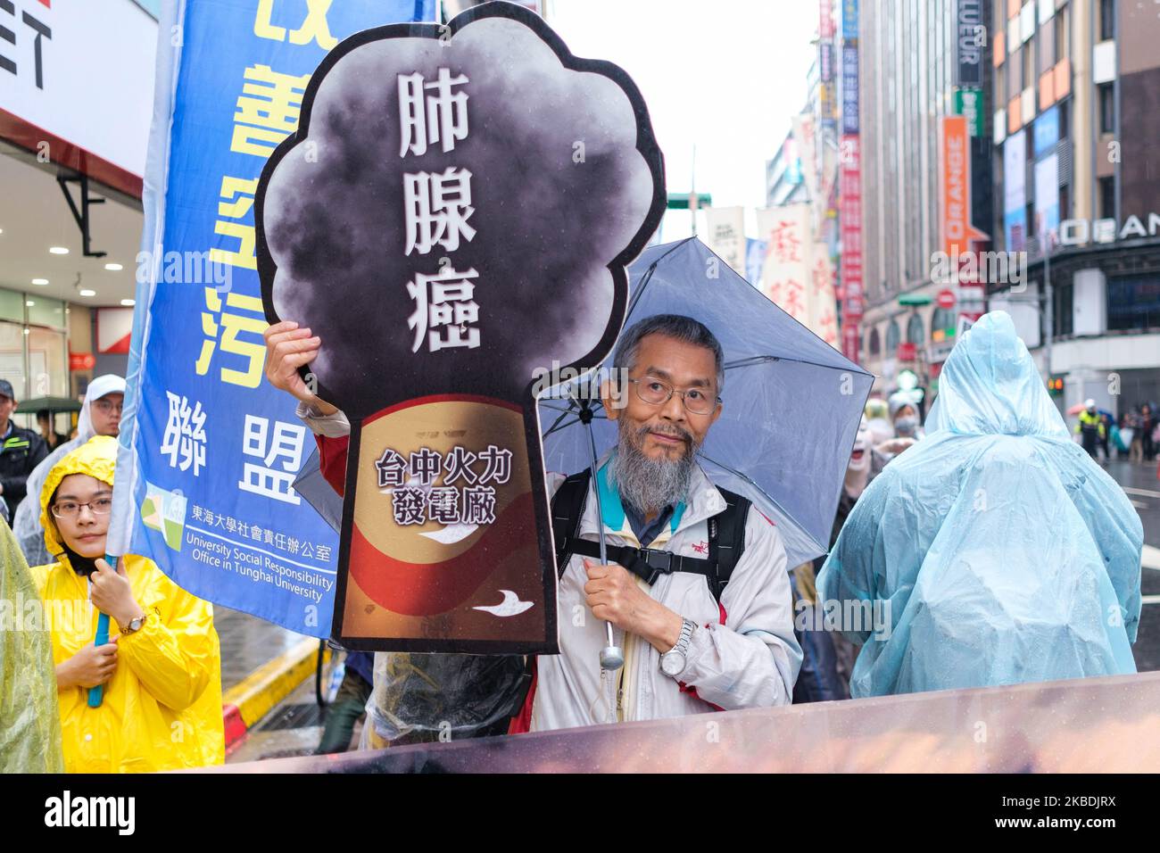 Man holding a sign saying ''Lung Cancer'' during a protest in Taipei ...